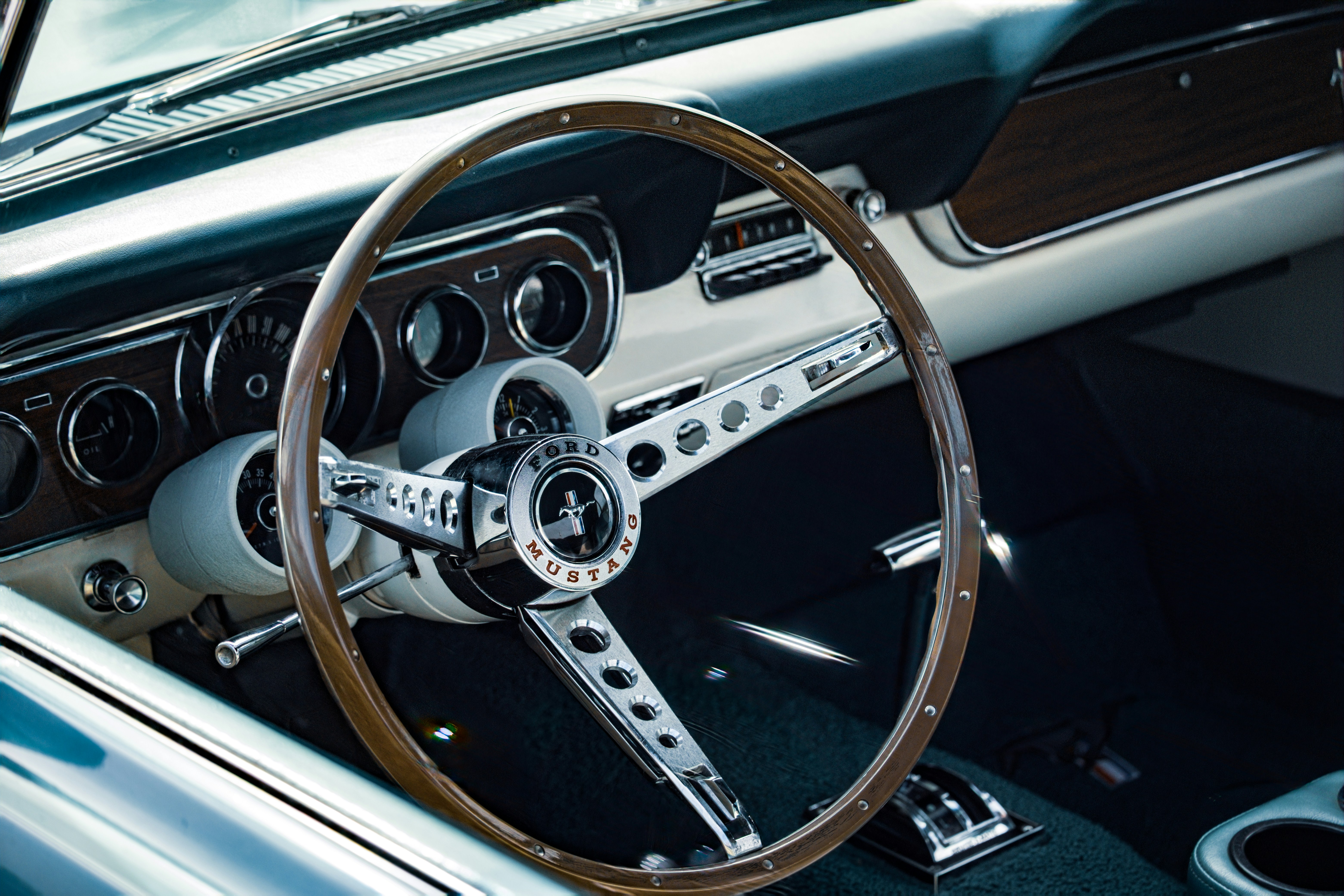 Heritage in Metal: The Classic Mustang Steering Wheel Amid Vintage Dash