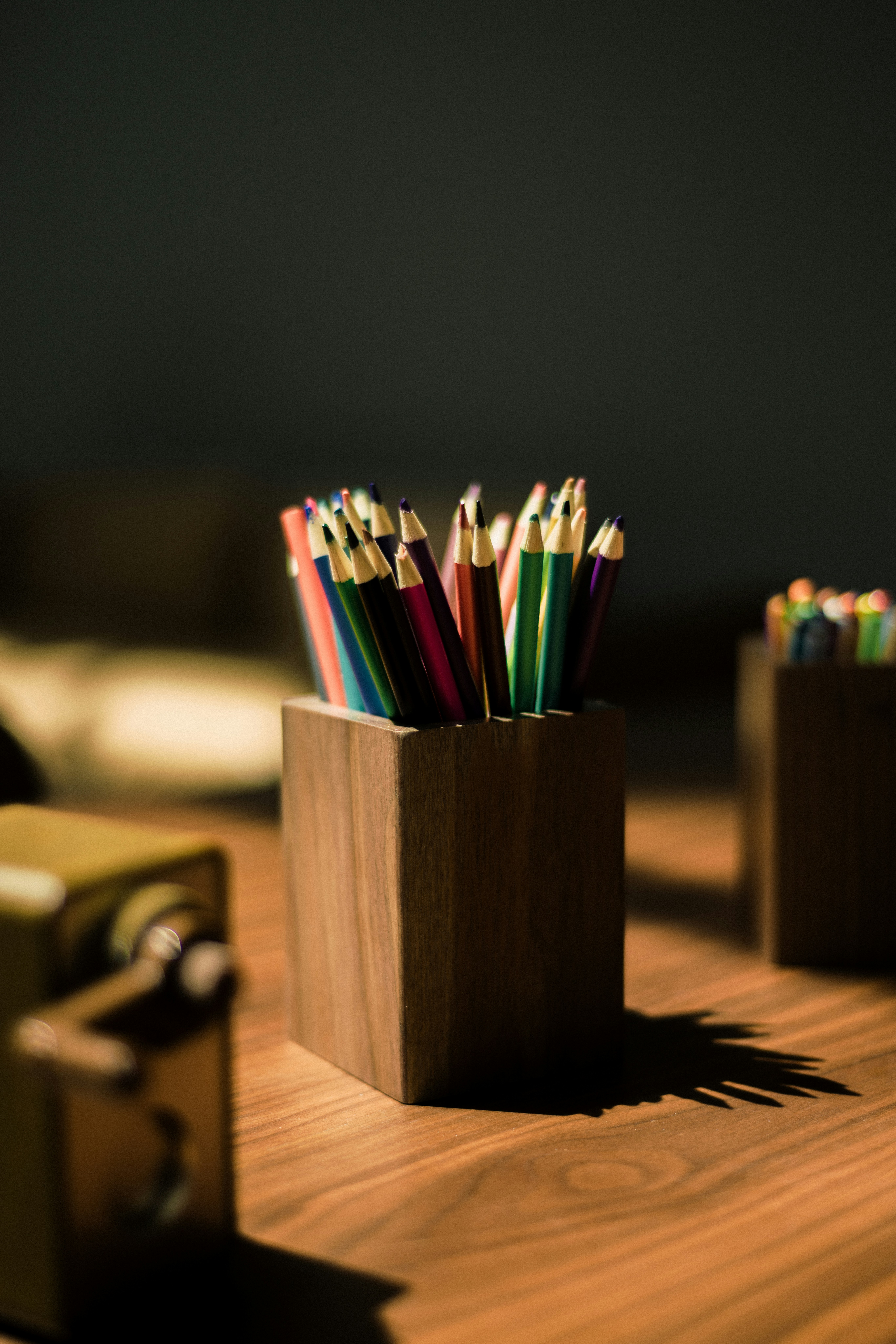 Vivid Pencil Tower: A Quiet Still Life in Warm Light