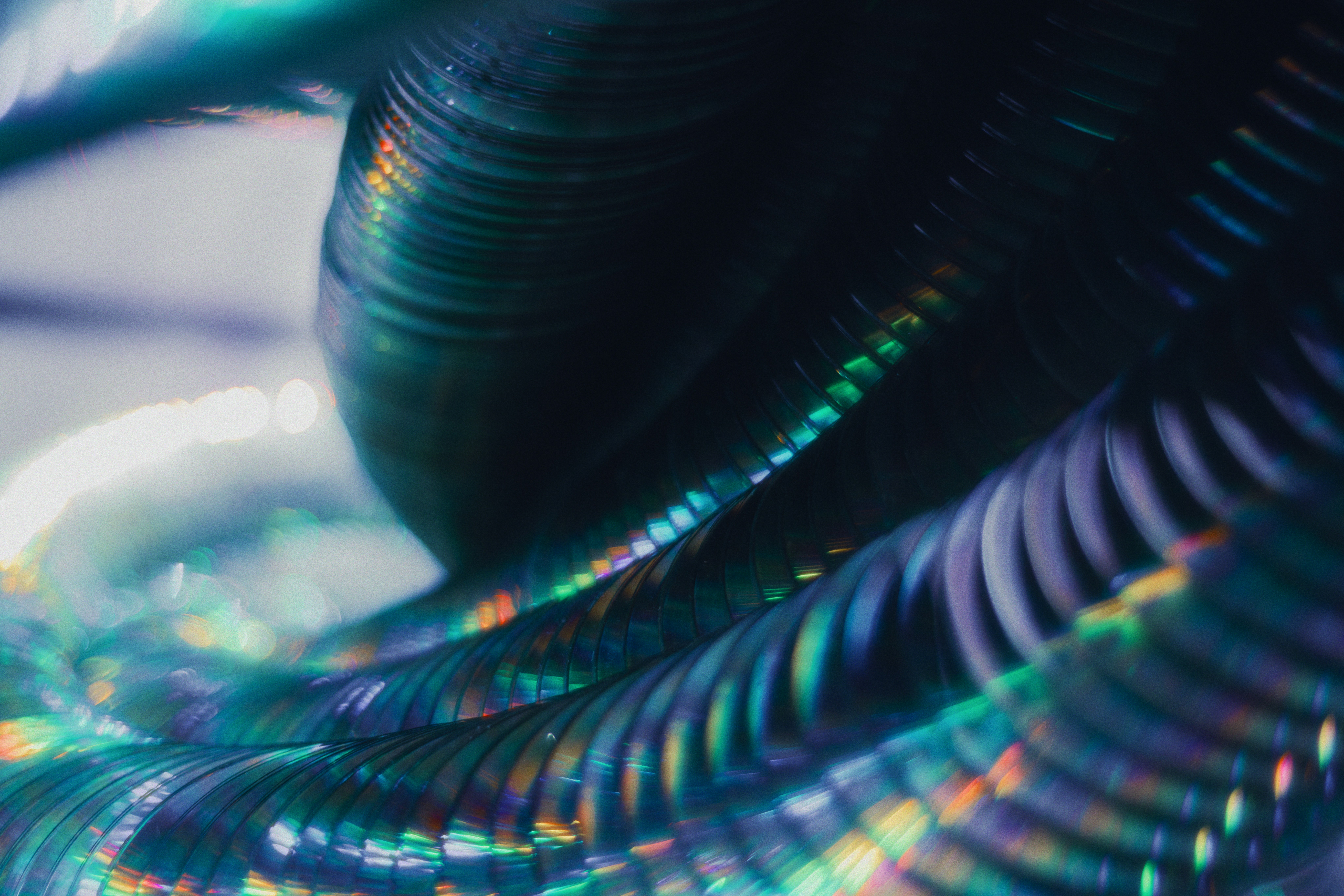 Prismatic Tangles: A Close Study of Iridescent Coiled Tubes