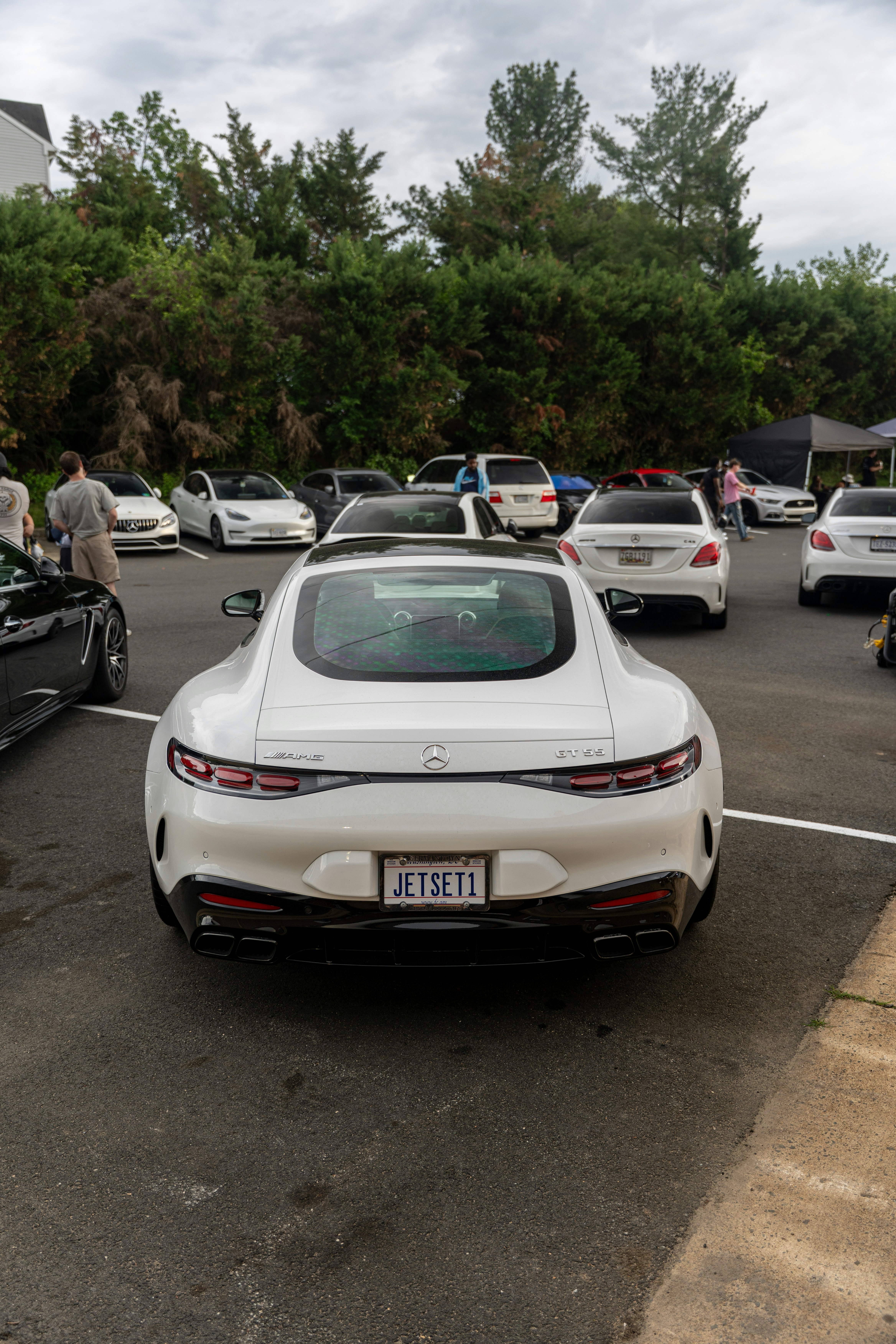 Jetset Mirage: White Mercedes in a Parking Lot Portrait