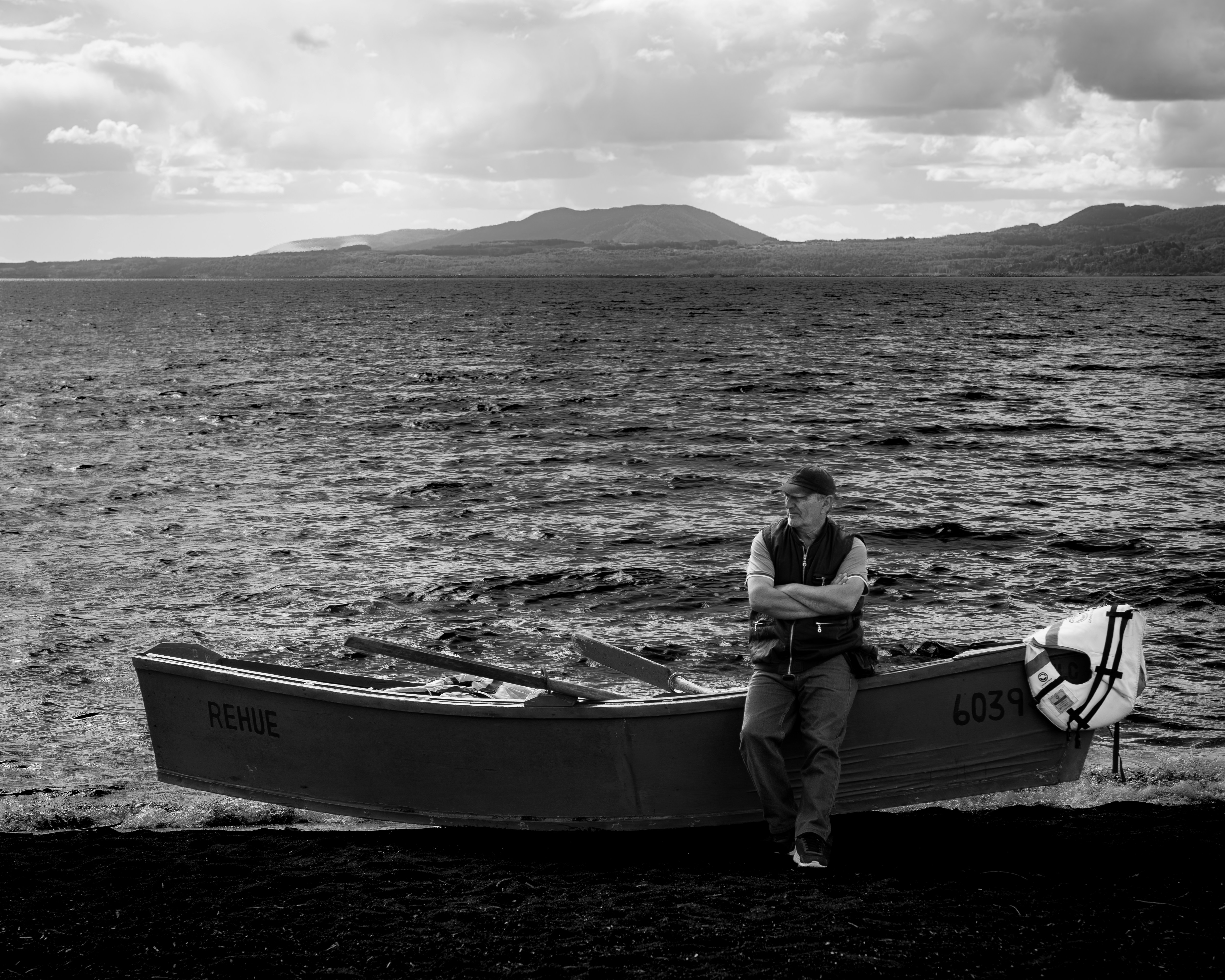 Lone Rowboat at Calm Shore, A Man Waiting Between Sea and Silence