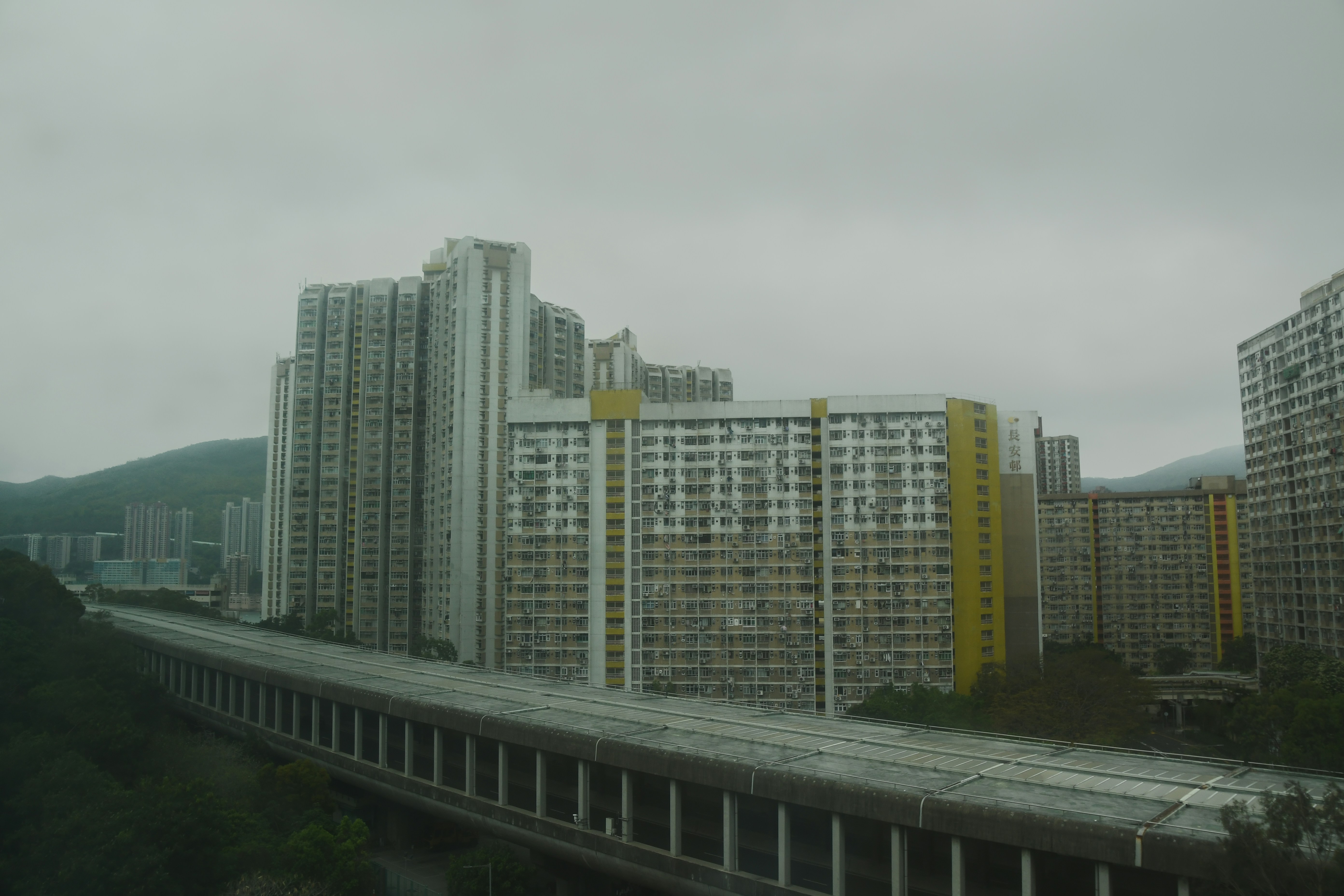 Urban Transit Overpass Framed by Distant Towers