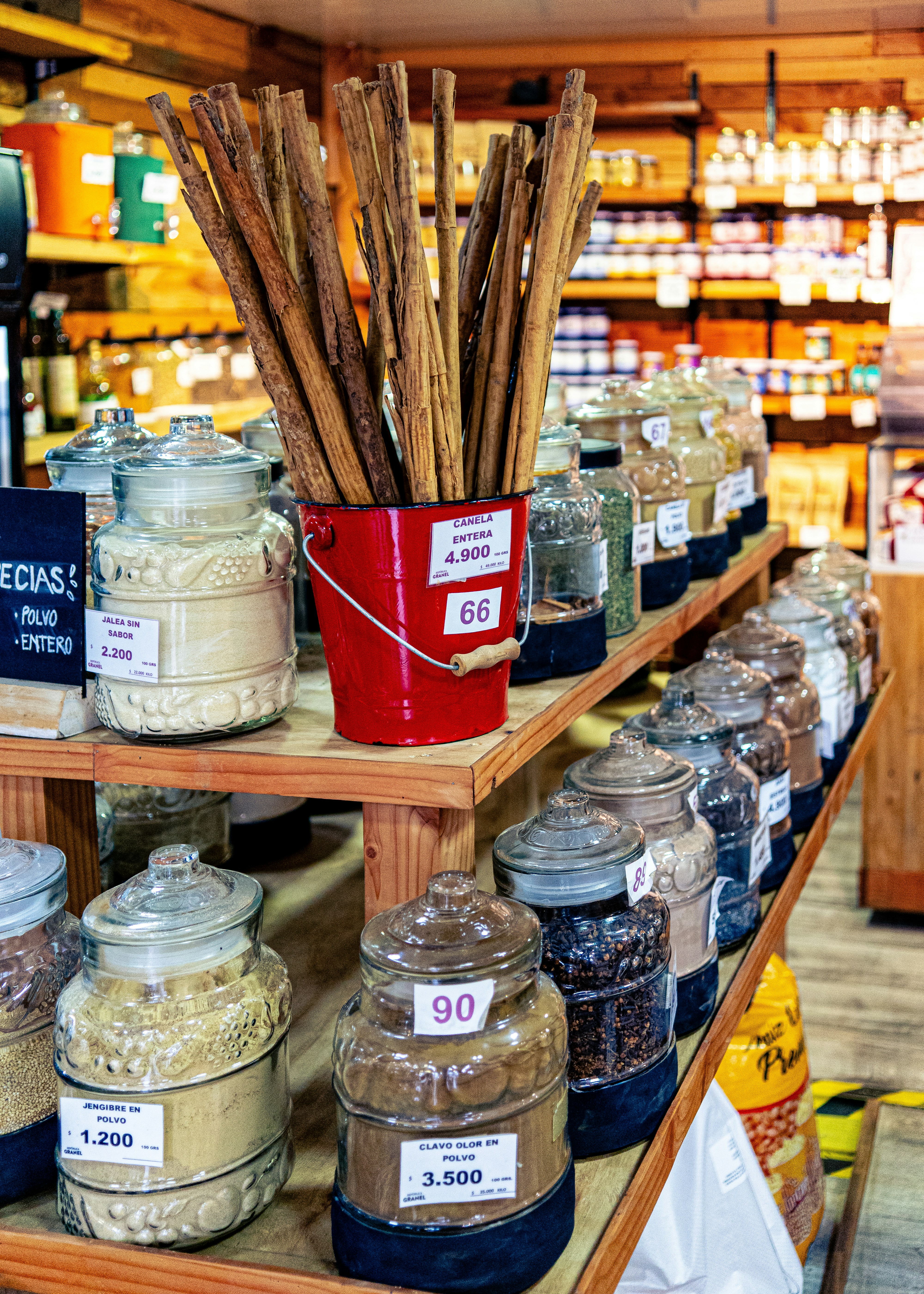 Cinnamon Sticks in a Rustic Aisle of Spiced Jars