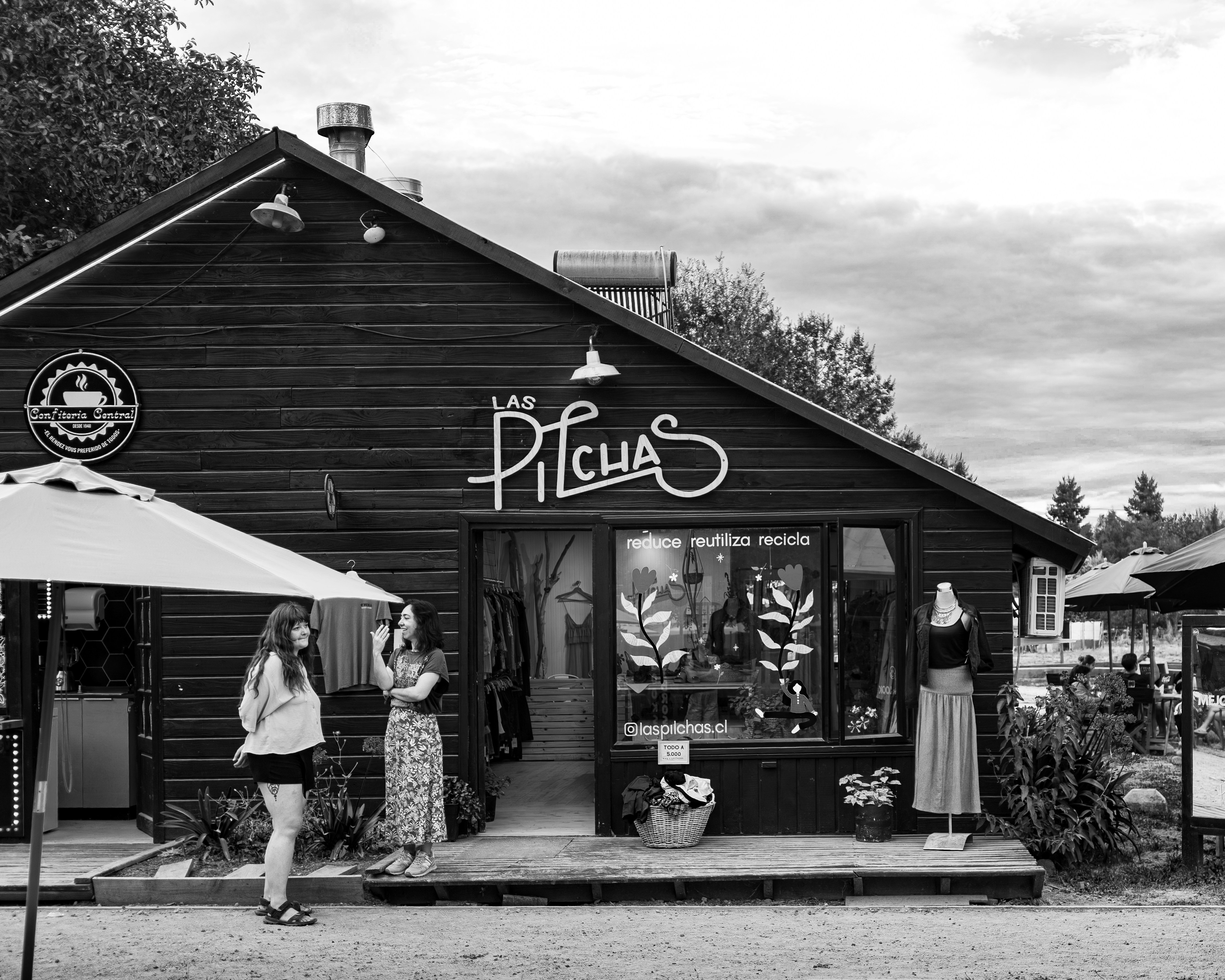 Shopfront Portrait: Quiet Interaction Outside a Rustic Studio