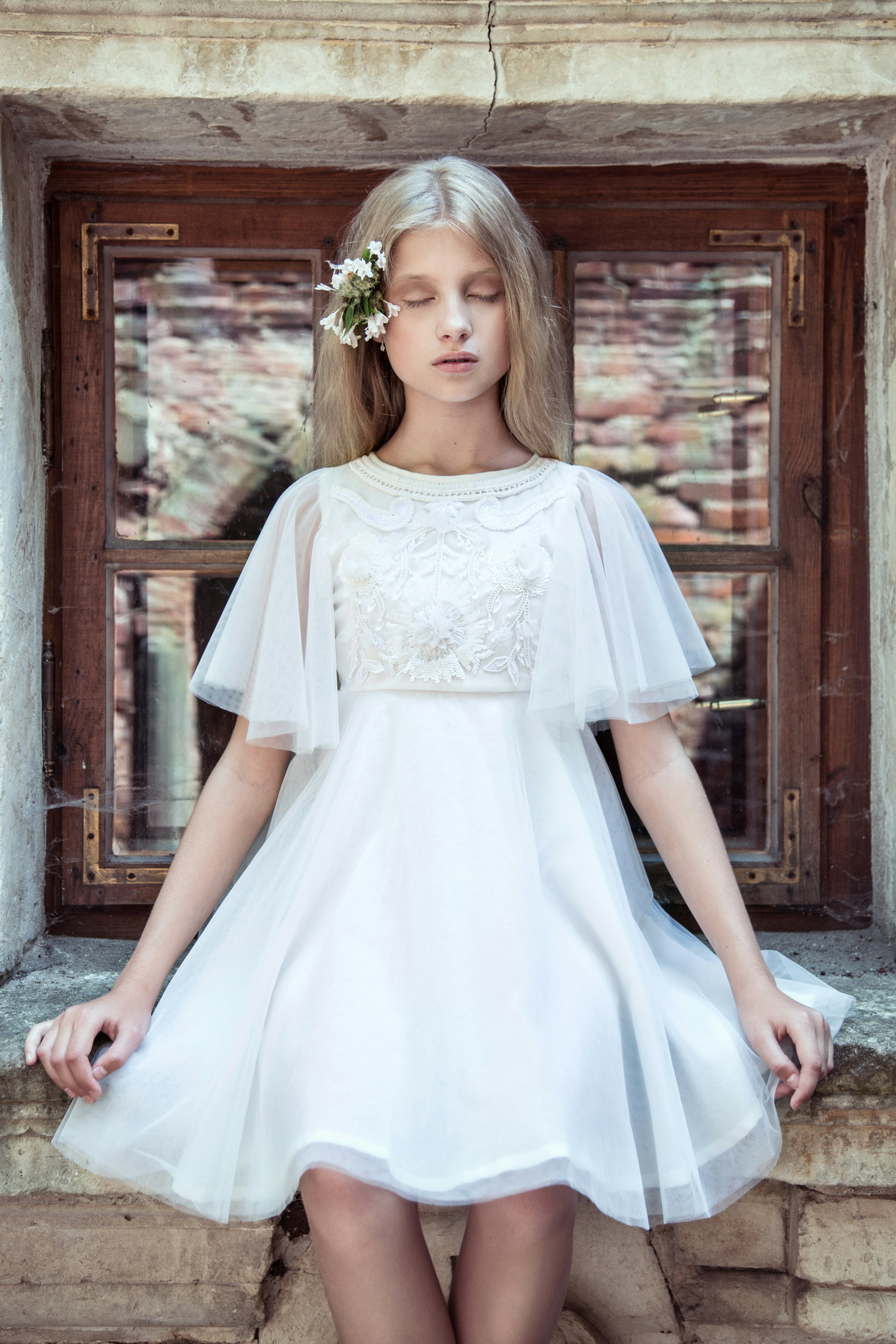 White Veil of Silence: A Portrait in a Silent Window