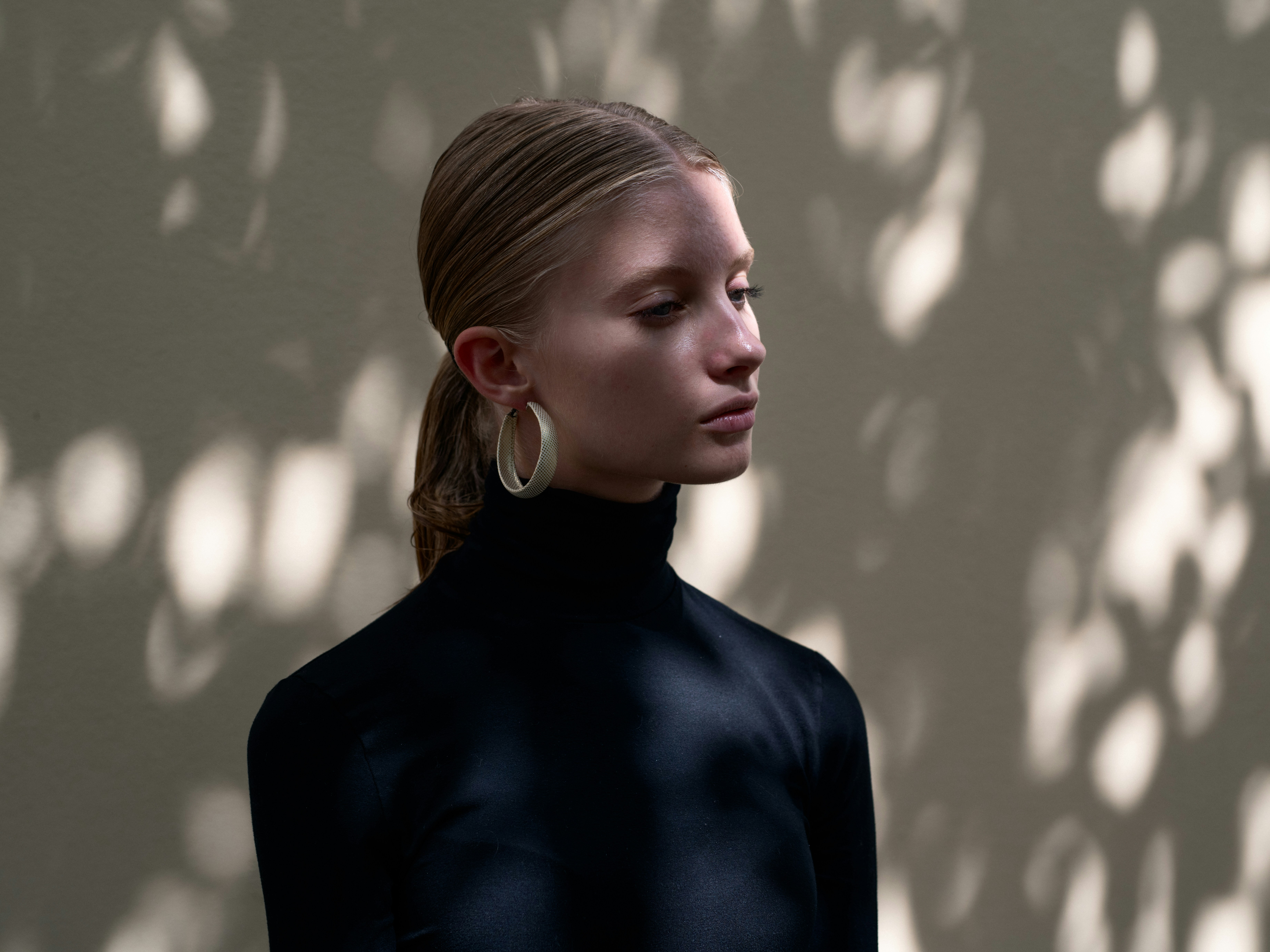 Muted Light, Strong Silhouette: Portrait in Shadowed Dappled Light
