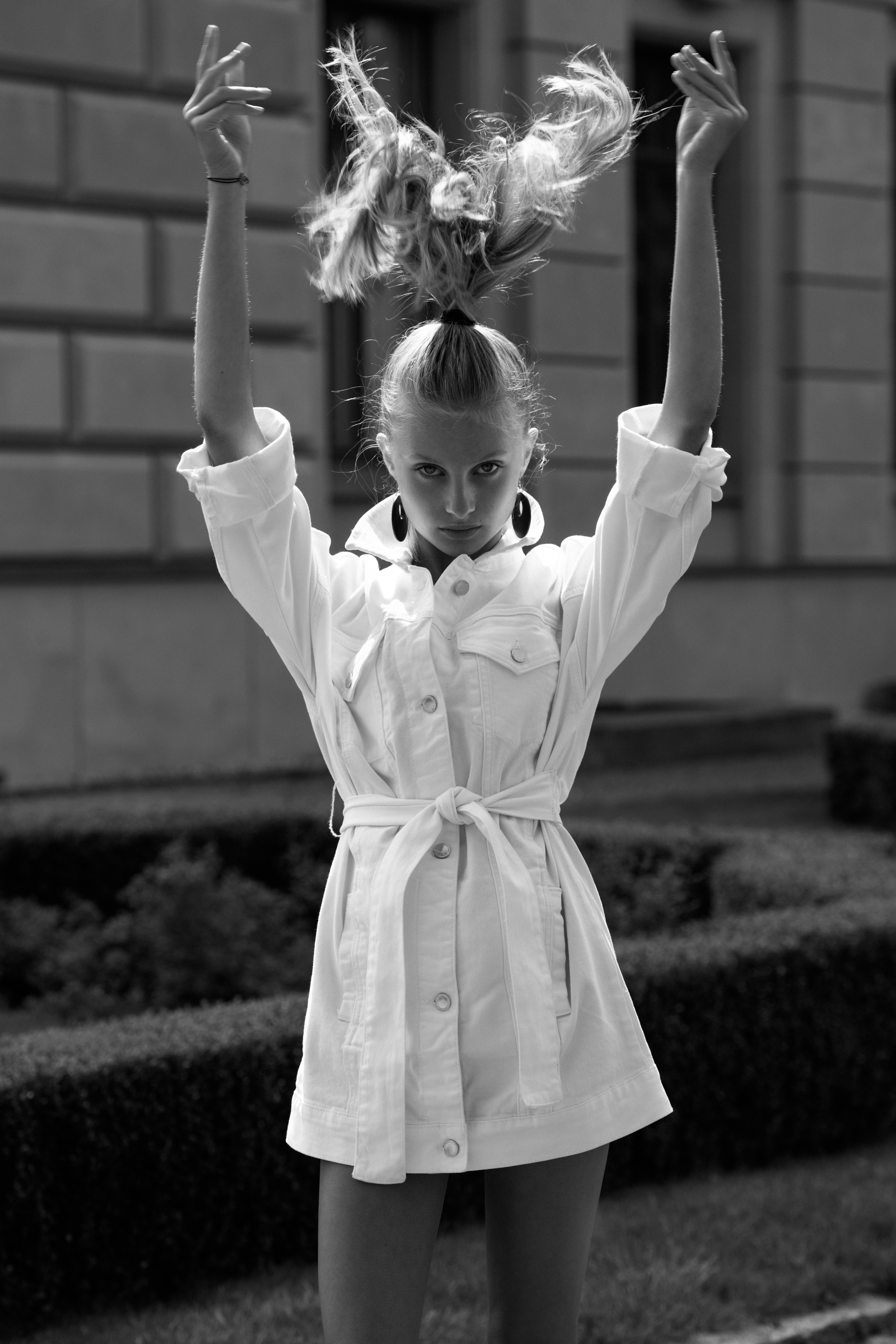 Arms Raised in monochrome poise