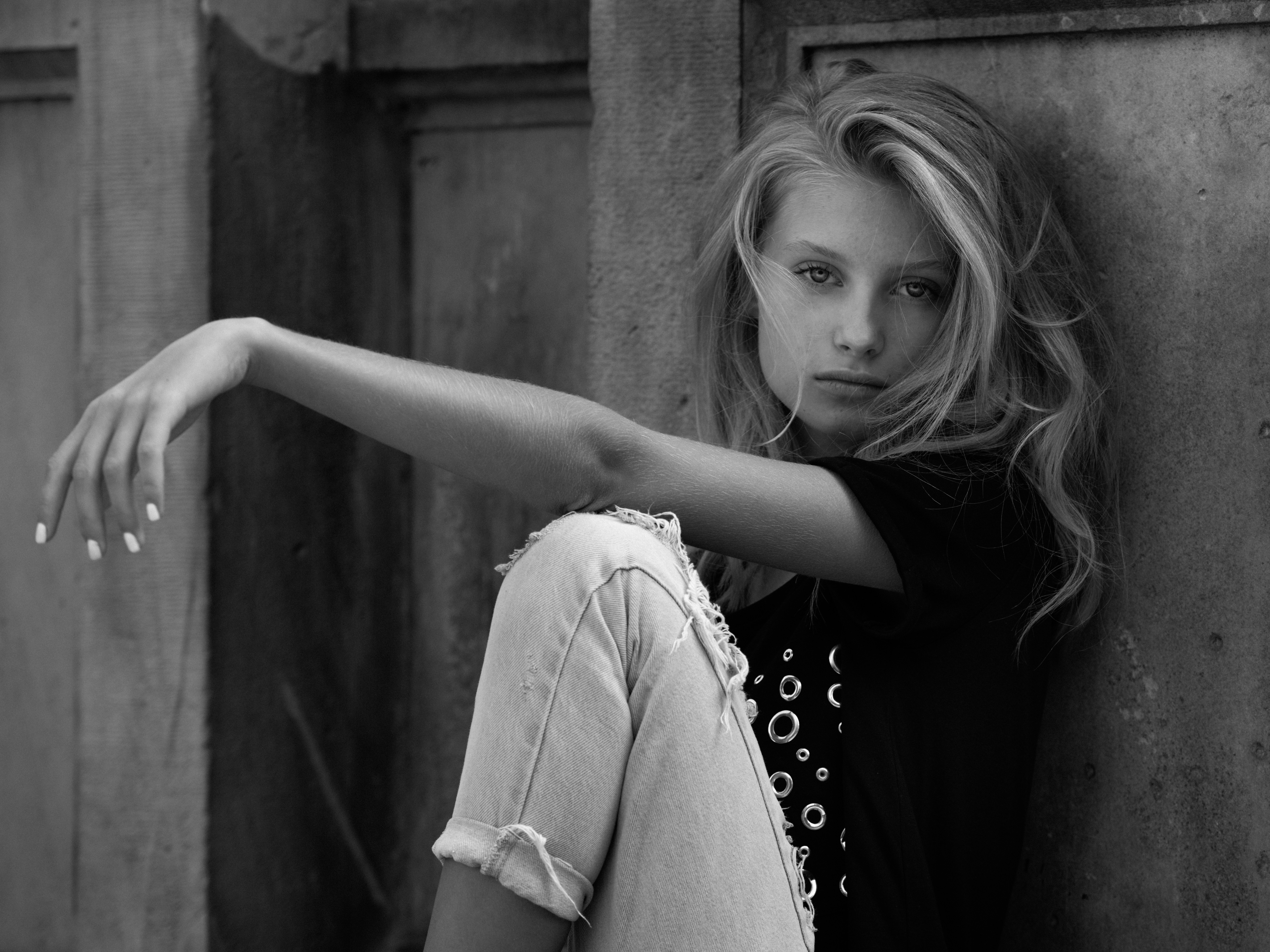 Lonely Edge: Portrait Against a Concrete Wall
