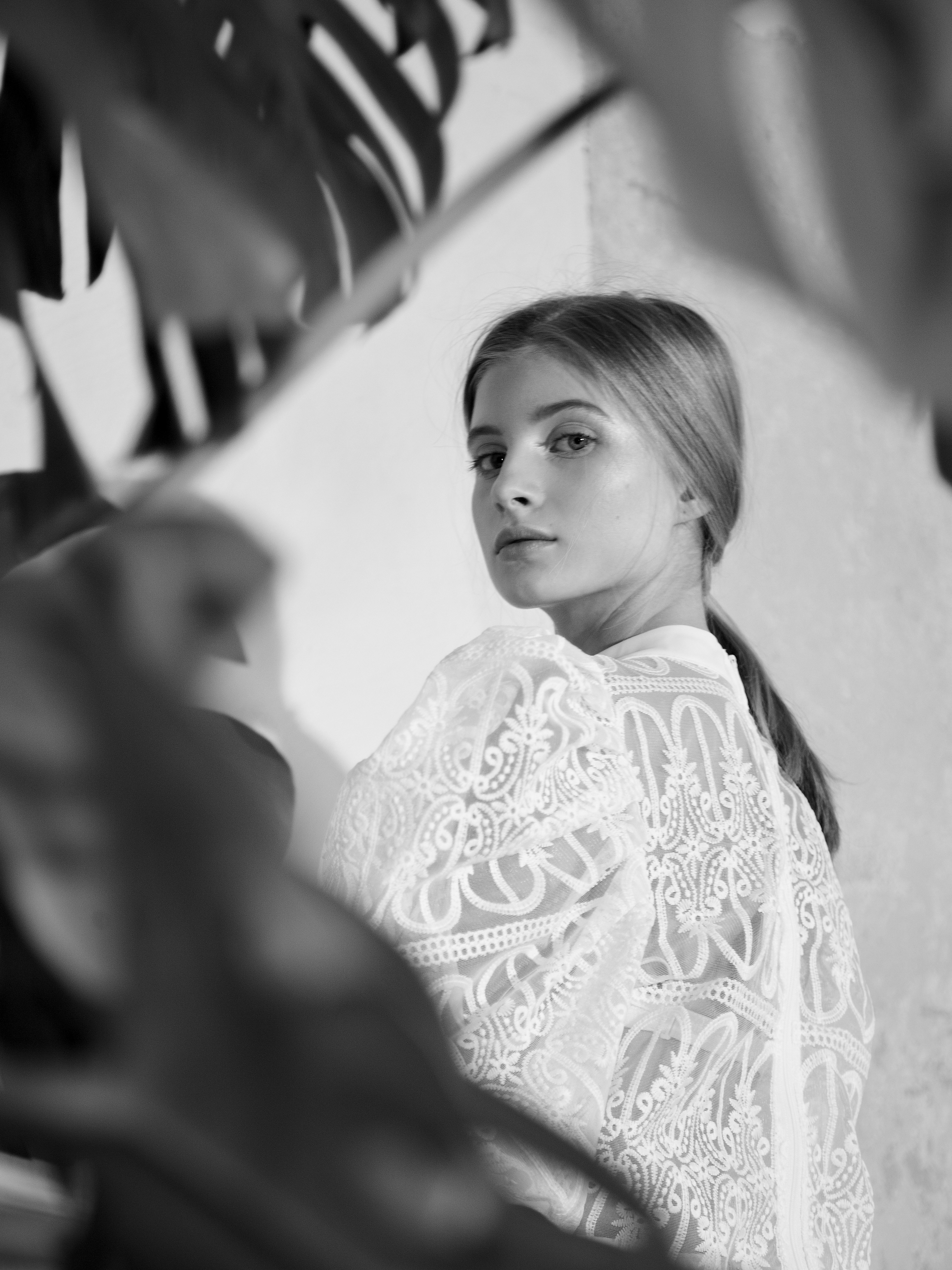 Portrait in Lace: Quiet Introspection framed by foliage