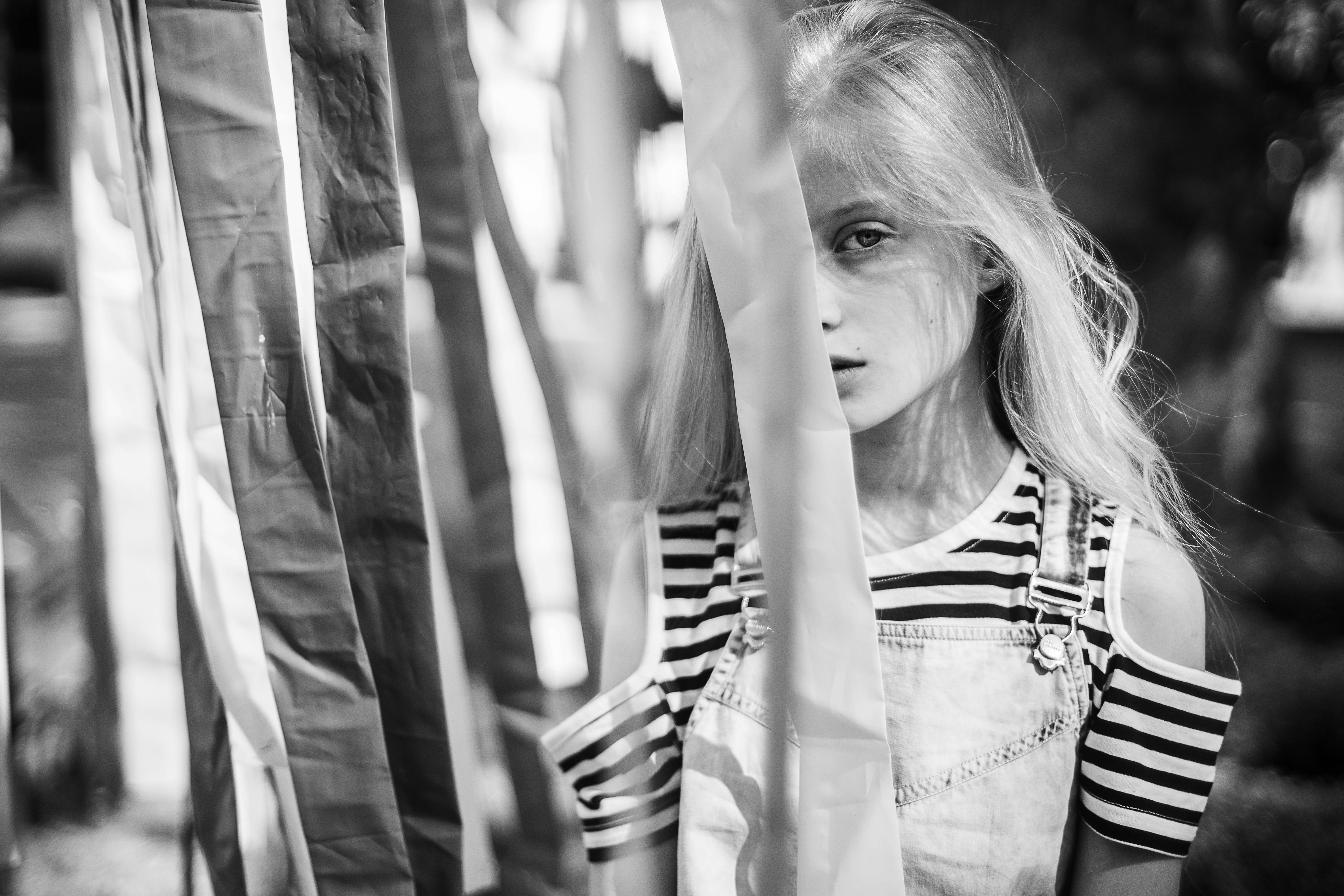 Strands of Light: A Portrait Behind the Ribboned Veil