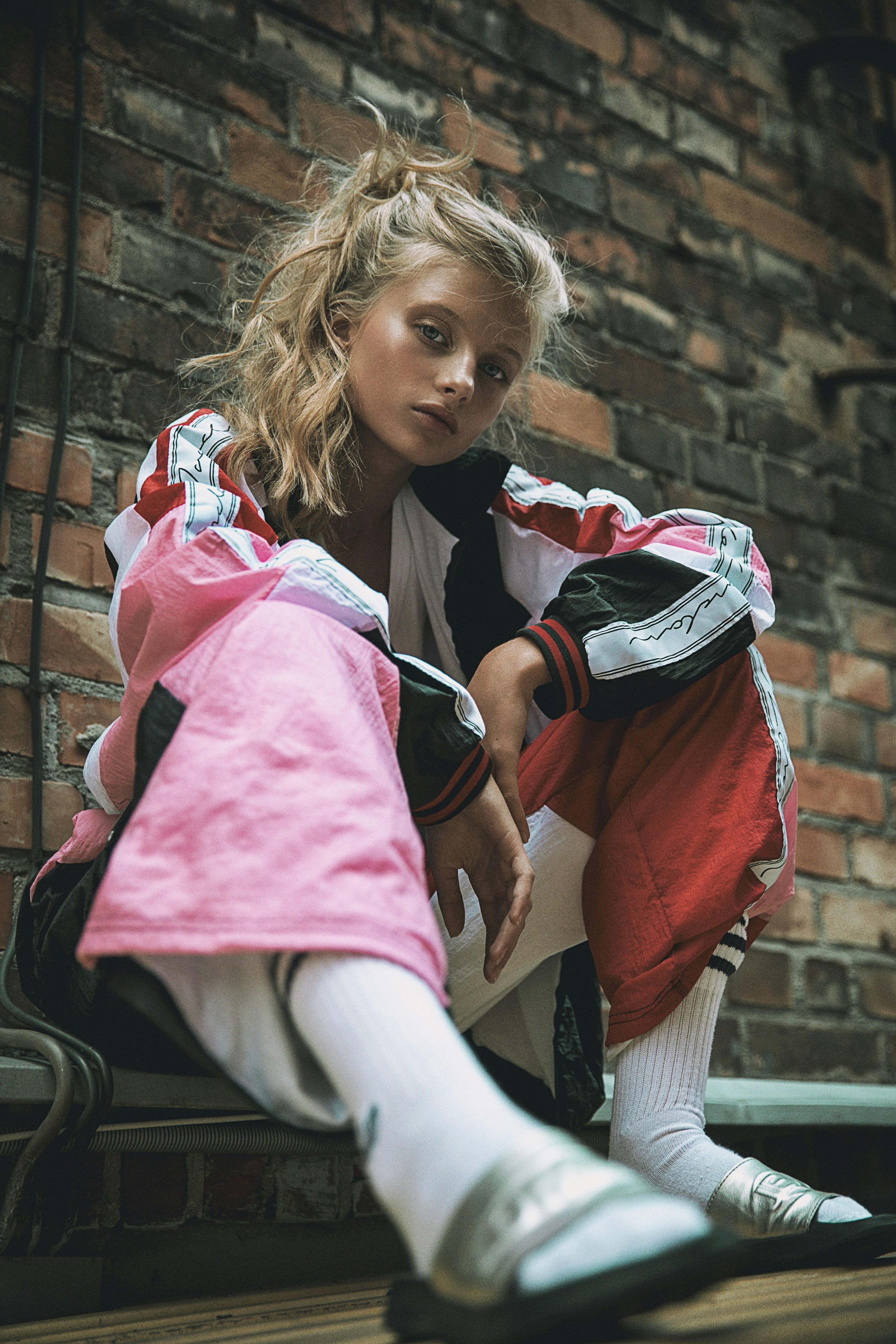 Edge of the Frame: Confident Gaze in a Neon Windbreaker
