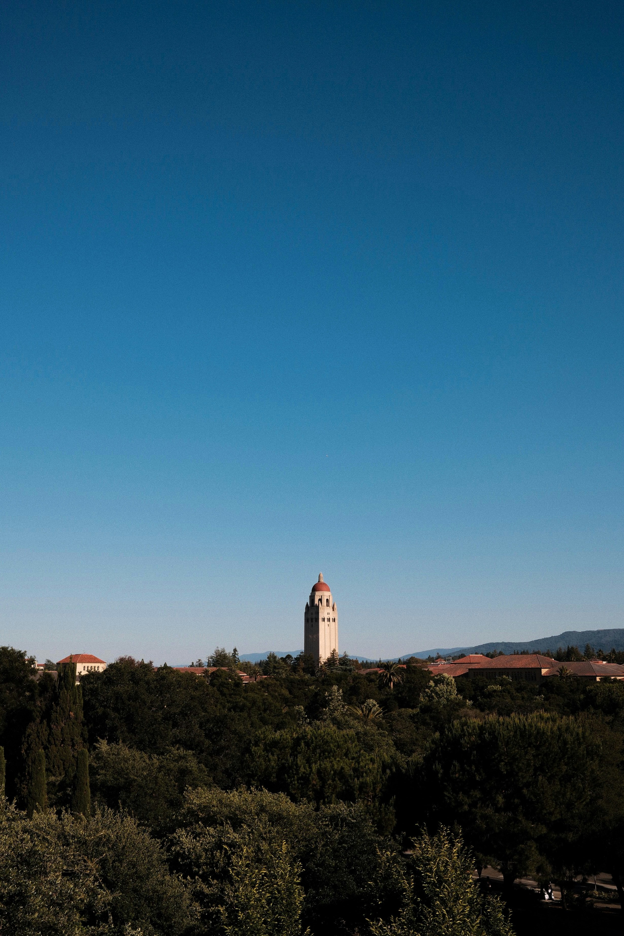 Towering Quiet: A Mediterranean skyline under a vast blue dome