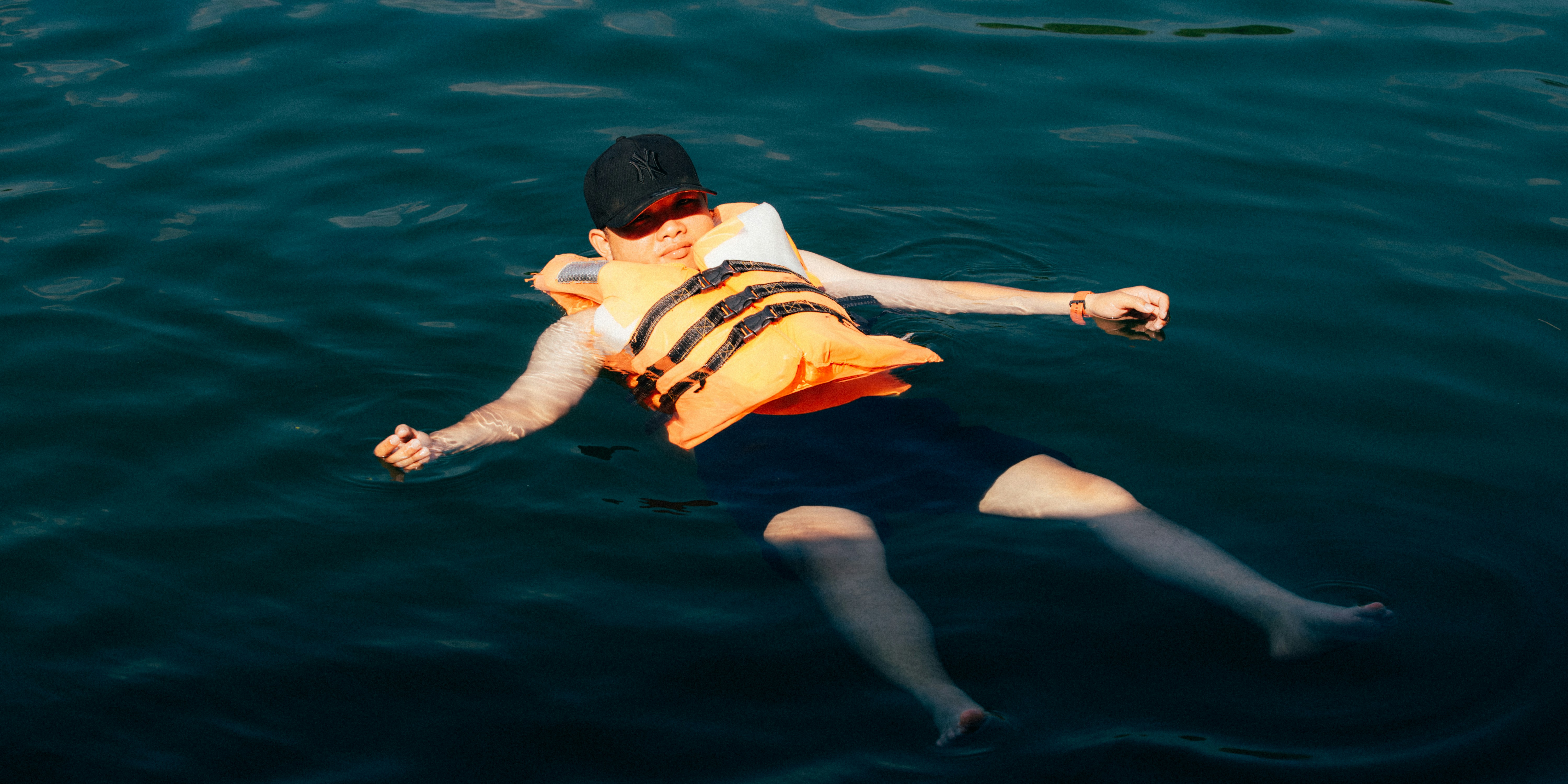 Lifebuoy Drift: A Sunlit Float Across Calm Blue