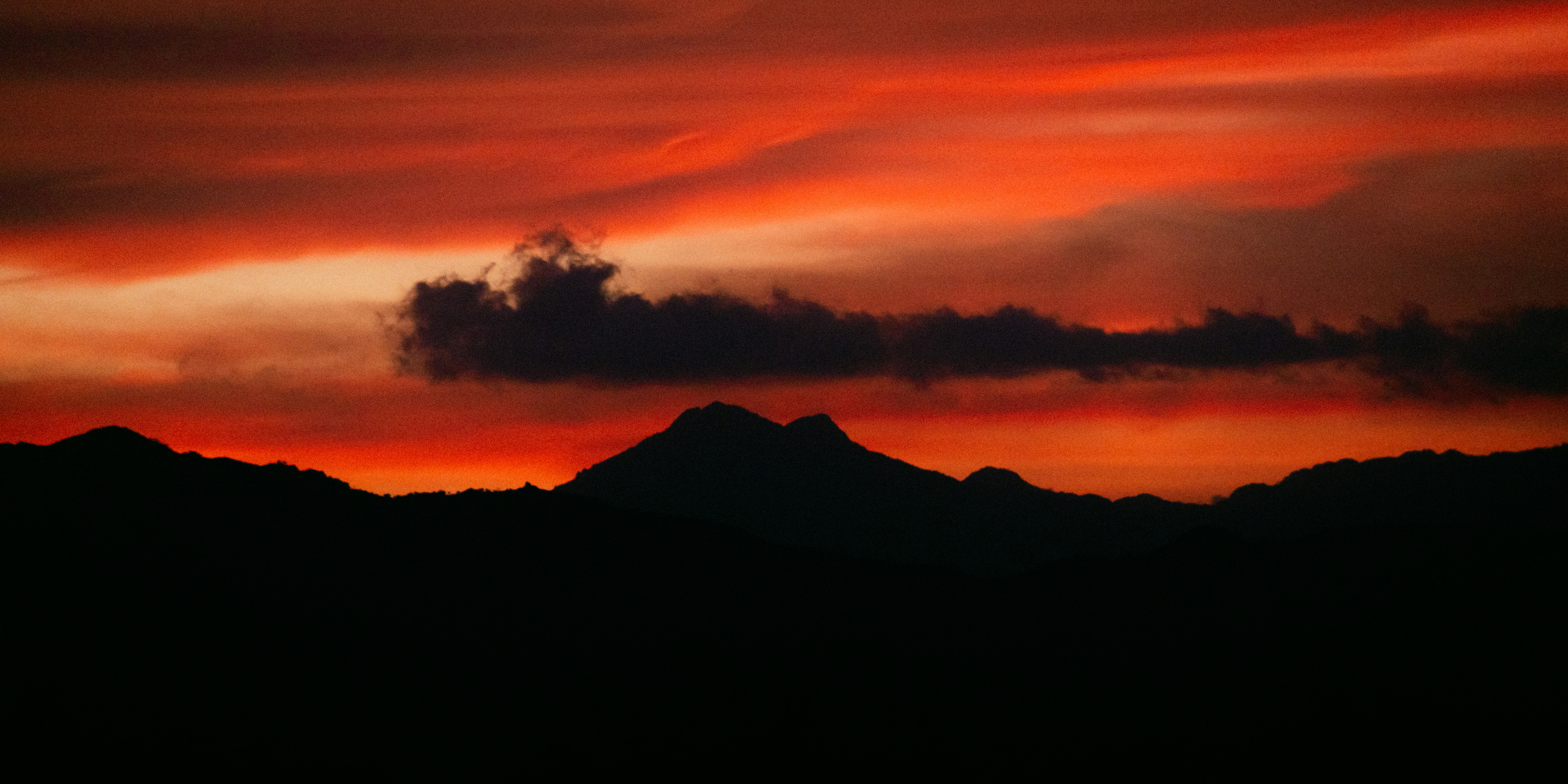 Silhouetted Ridge at Ember Dawn