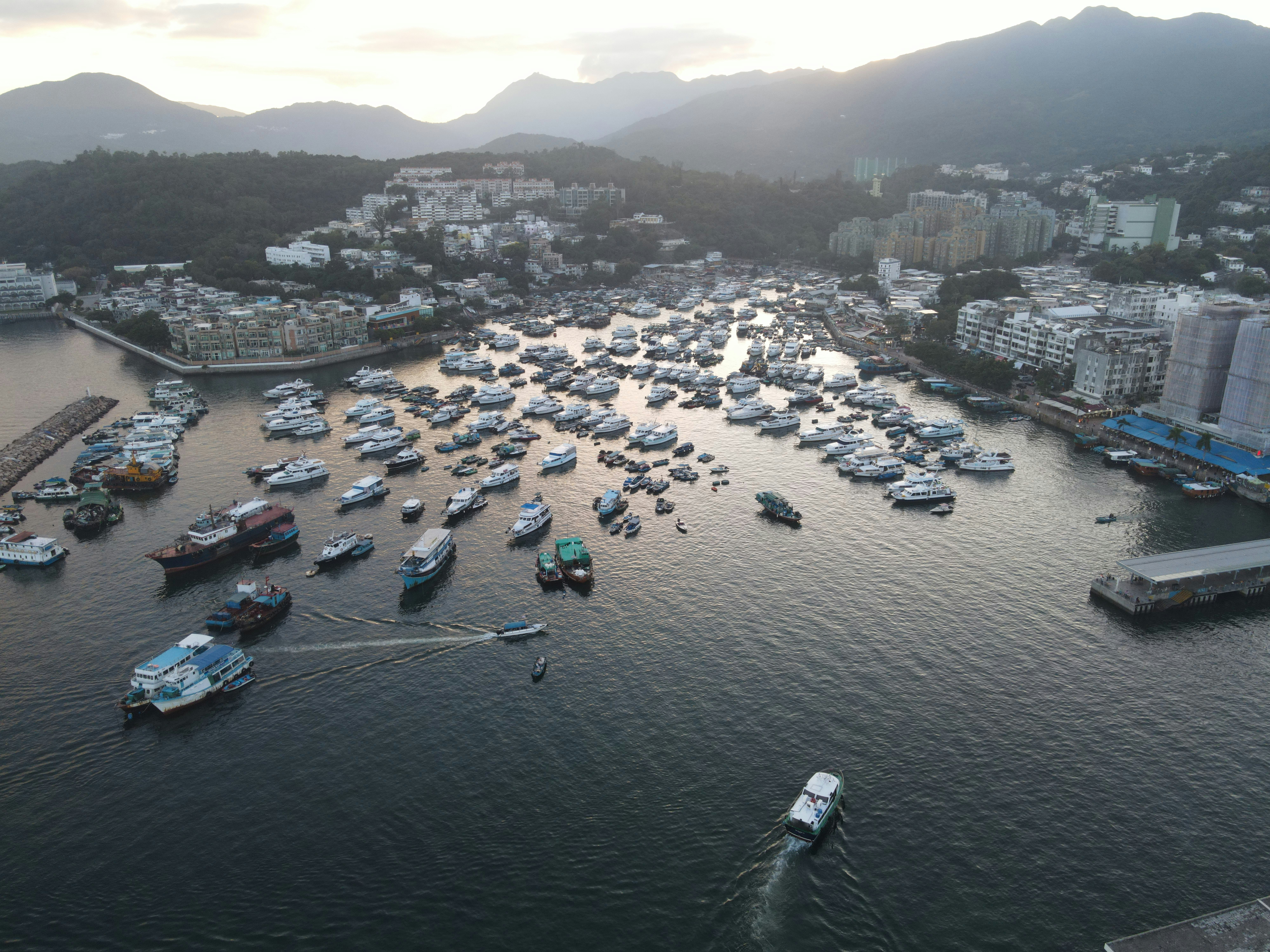 Harbor Mosaic: Boats Resting in a Quiet Bay at Dusk