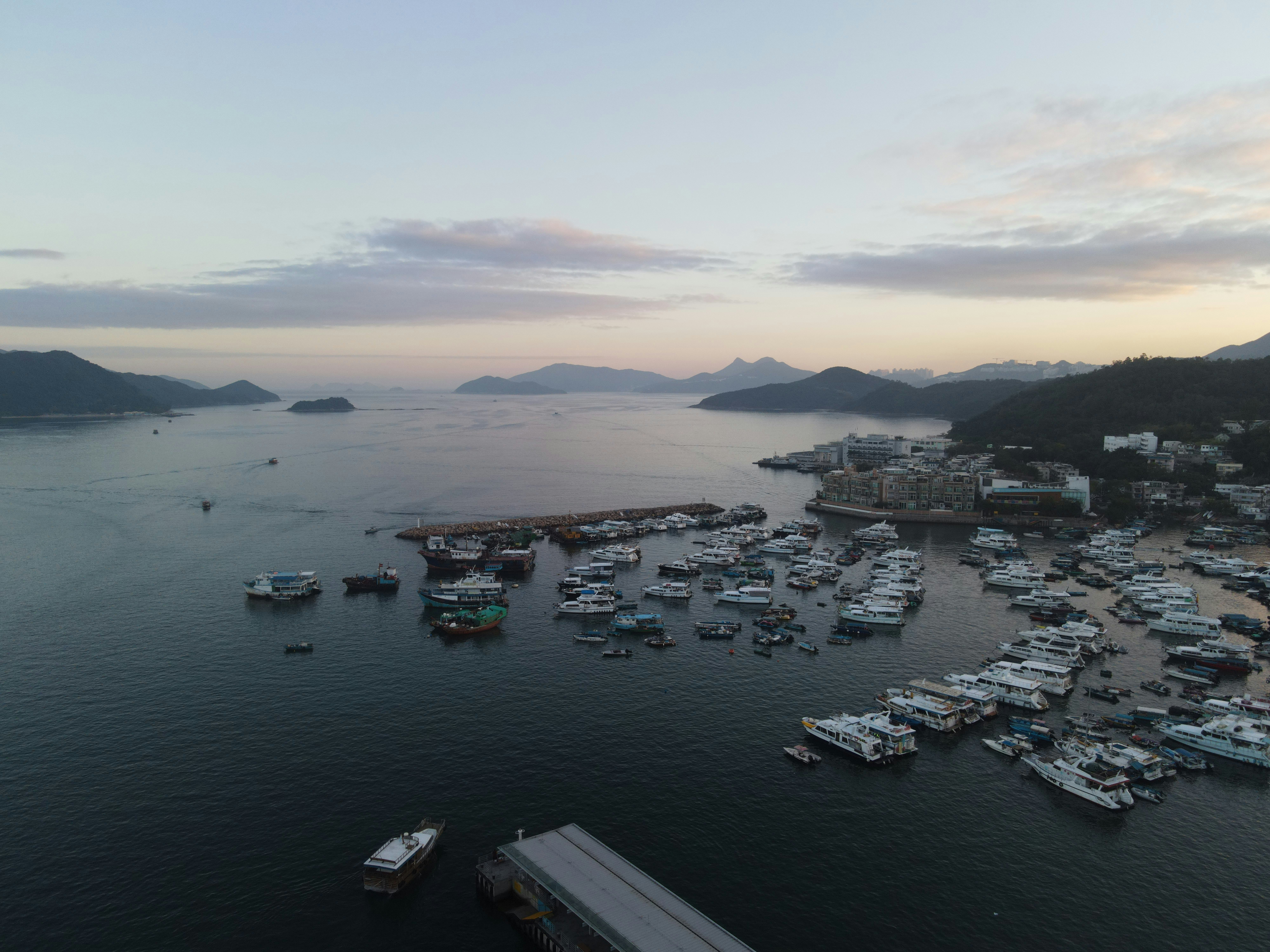 Calm Marina at Dusk: Boats Gather in a Pearl Harbor of Water