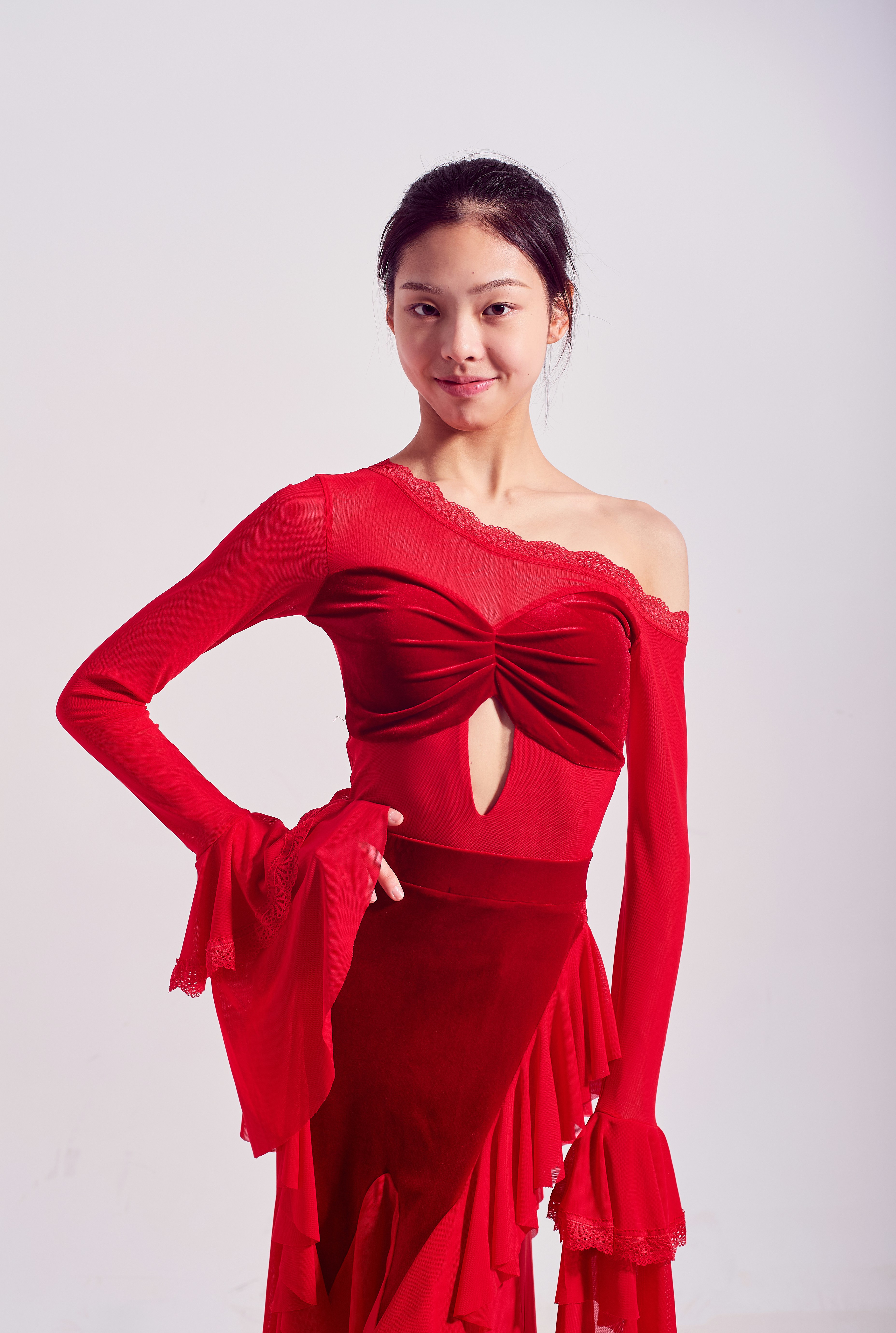 Red Velvet Silhouette: A Confident Poise in Velvet Drama