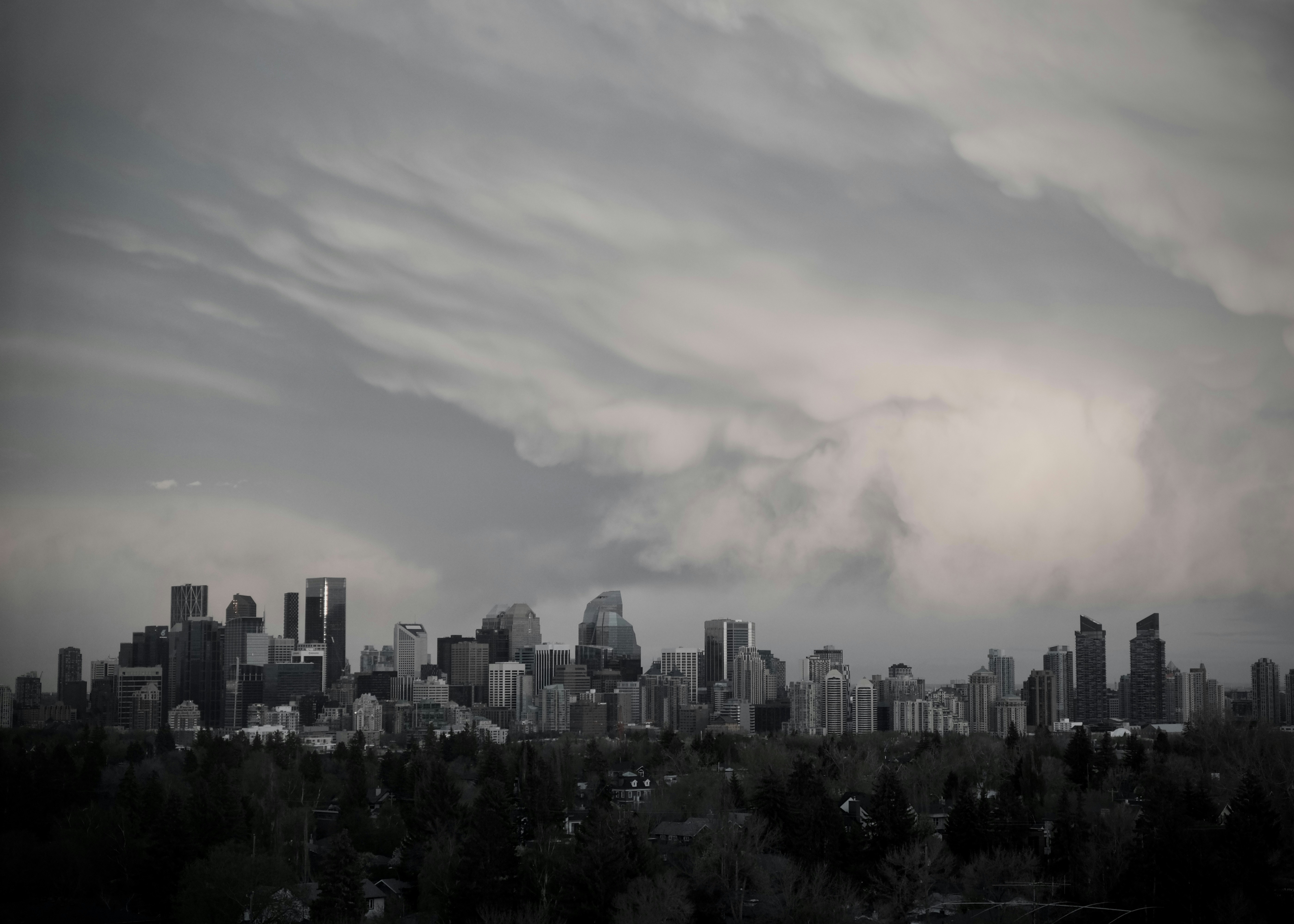 City skyline under a dramatic cloudy sky photo – Free Cityscape Image ...