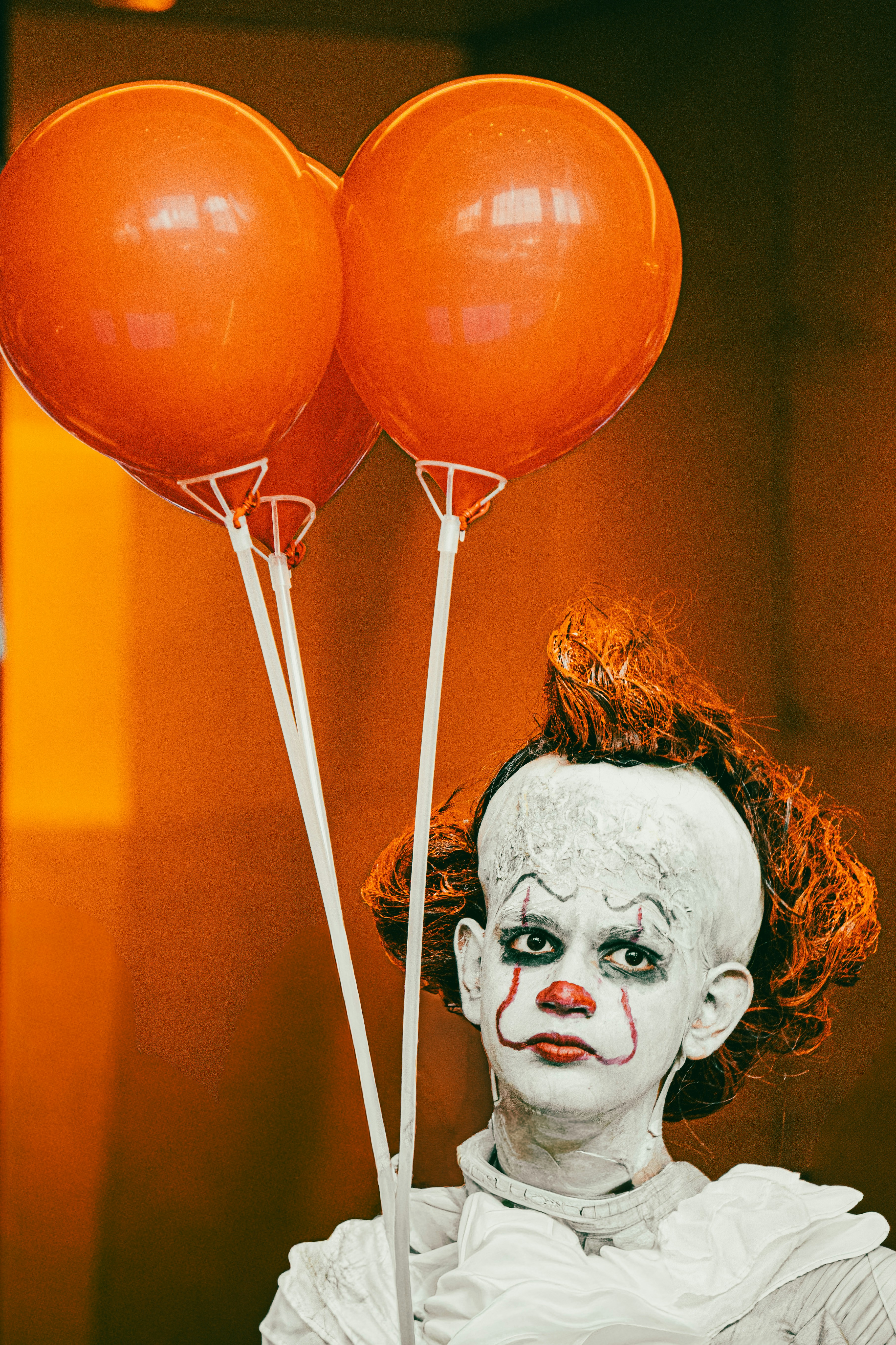 Ballooning Contrast: A Clown's Quiet Gaze