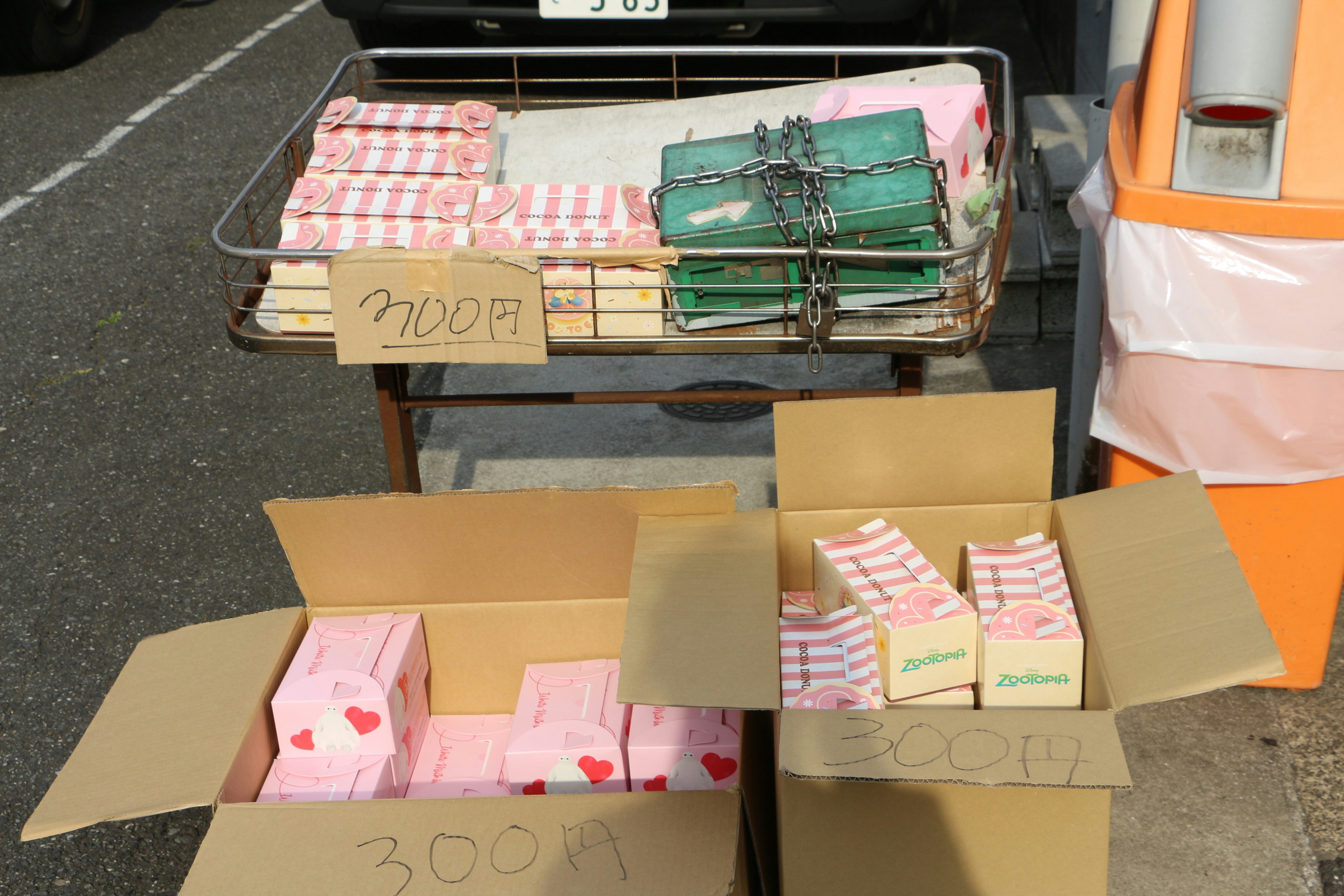 Cartons of Sweet Surprises: Pink Hearts and Wrapped Treats on a Street Stall