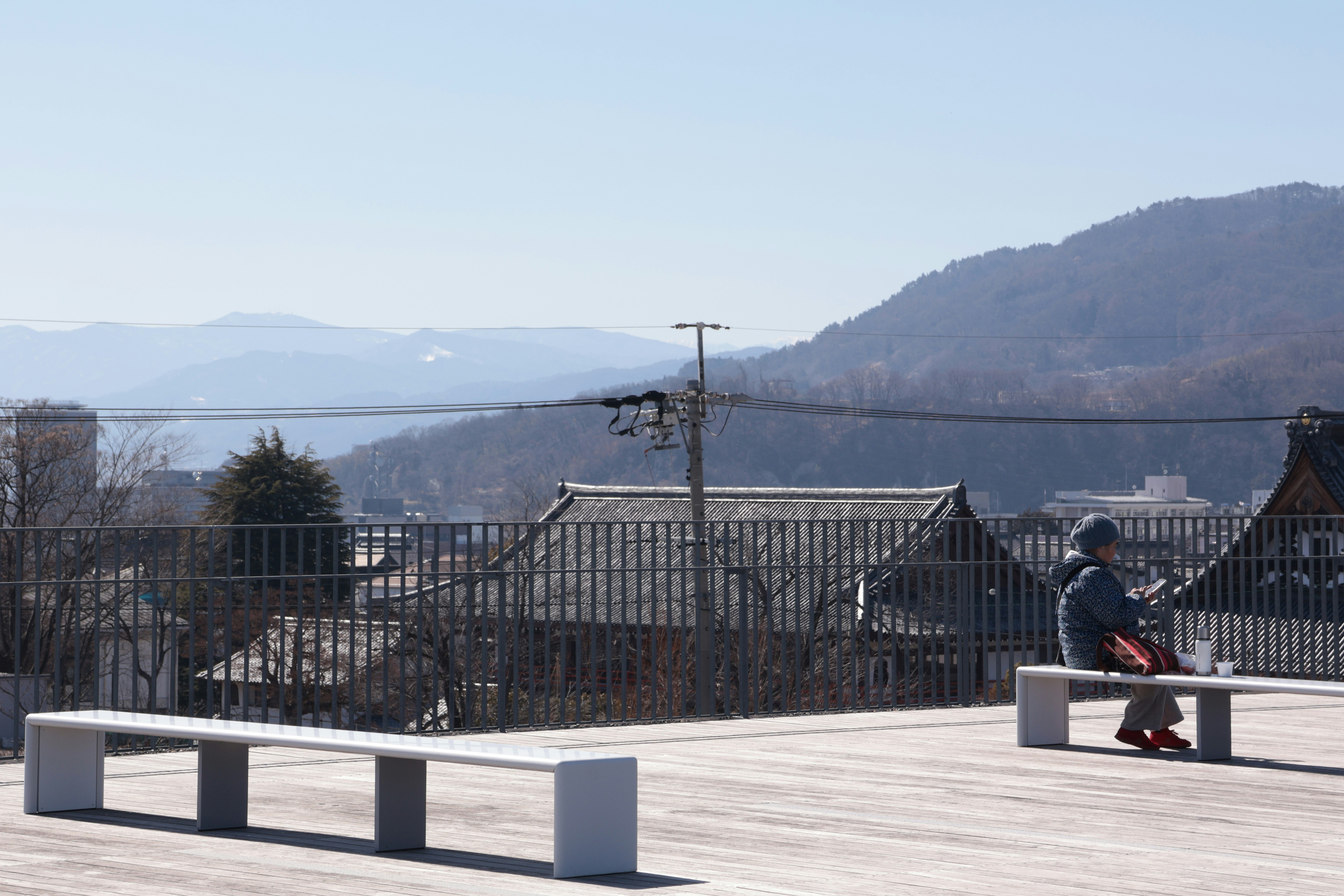 Solitary Observer on a Cliffside Terrace