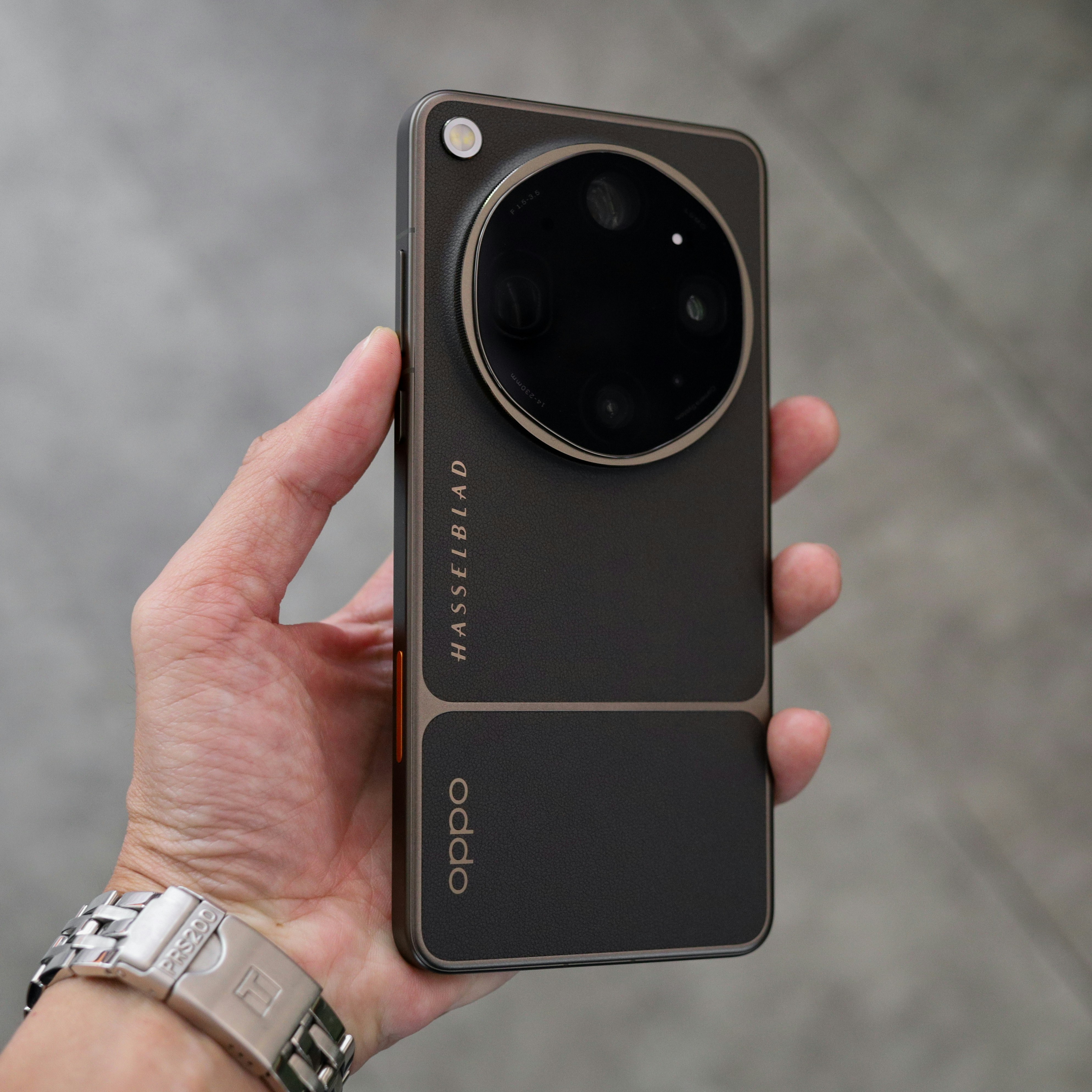 Bold Glass: A Close-Up of the OPPO Hasselblad Phone in Hand