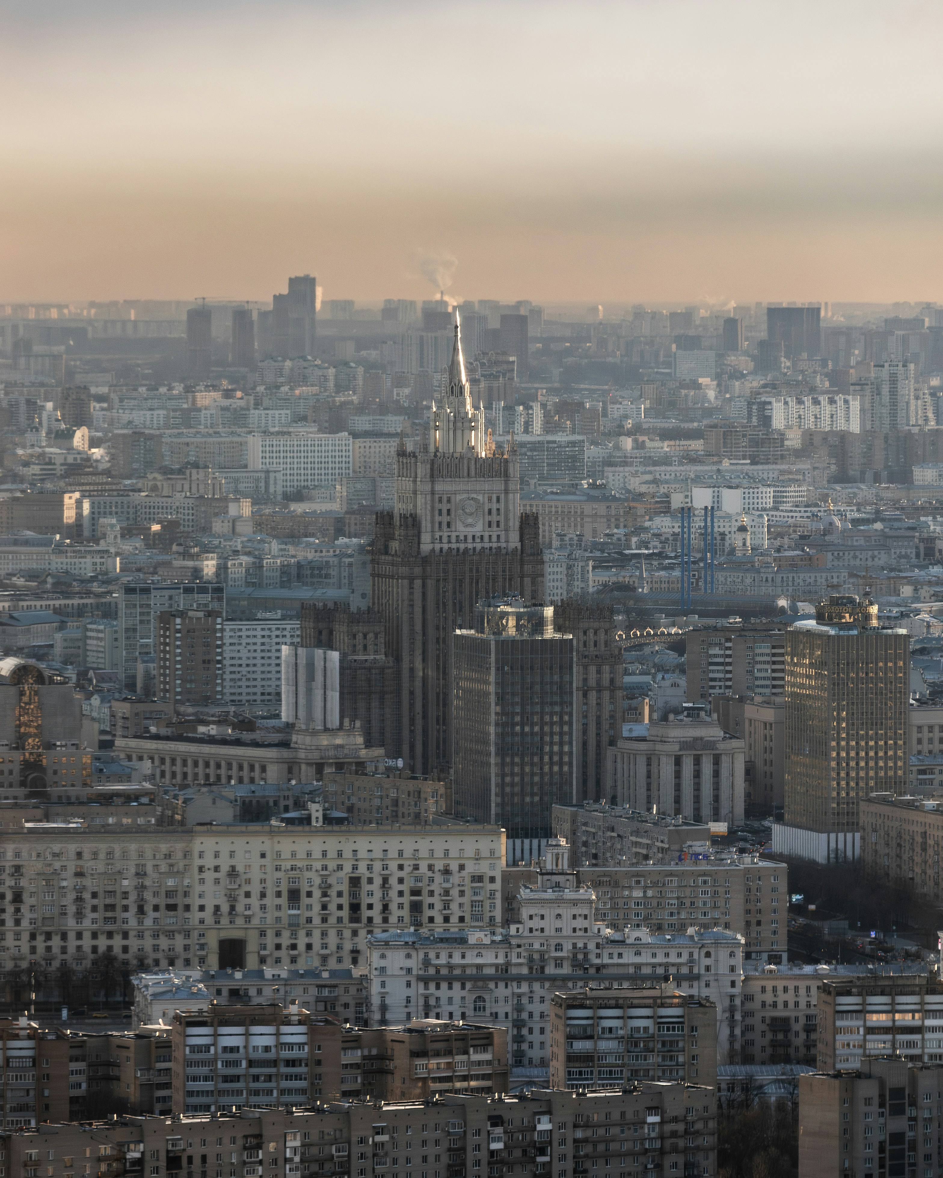 Soaring City Crown: The Central Needle Rising Above a Sea of Blocks