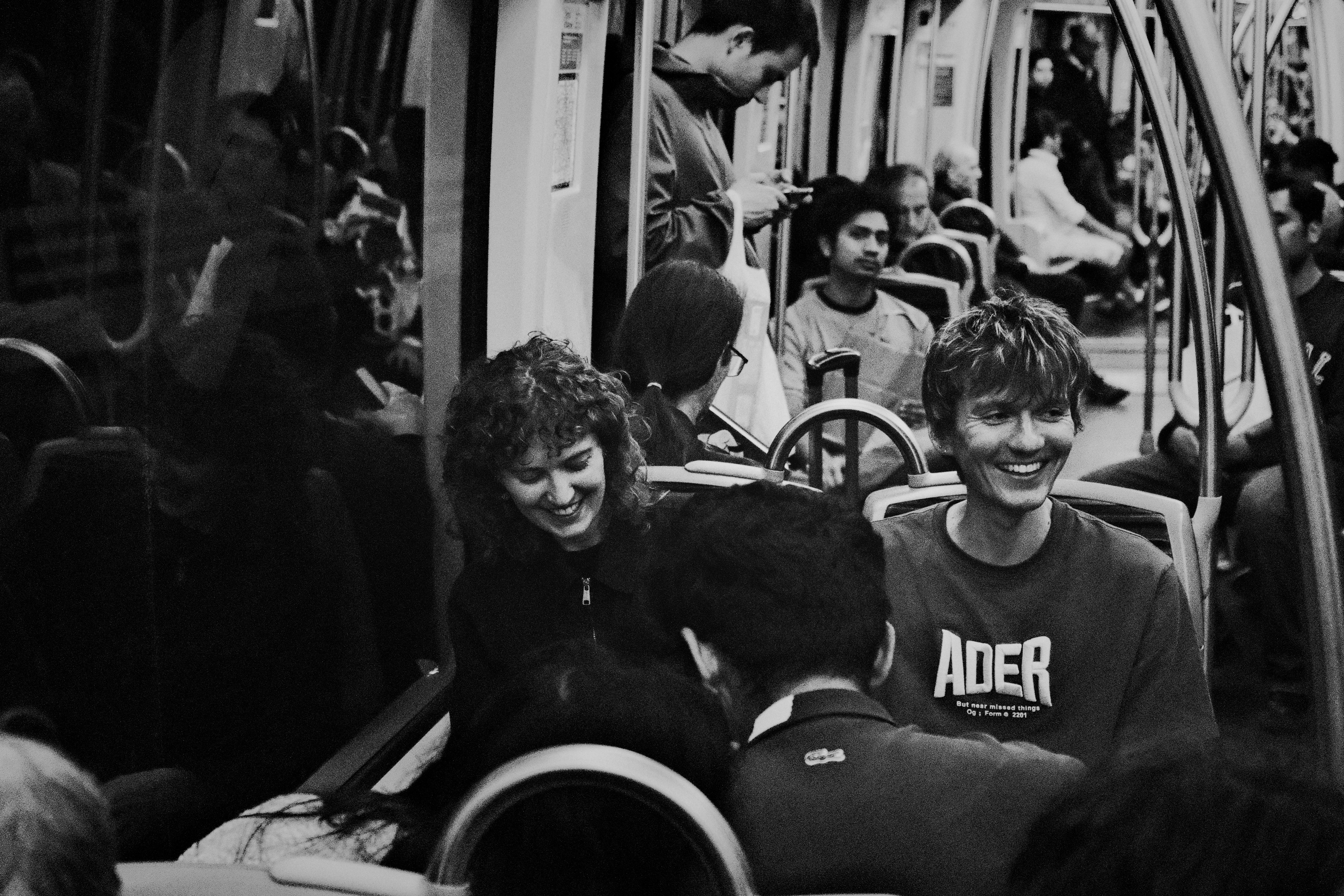 Smiles on the Metro: Quiet Connection Amid the Crowd
