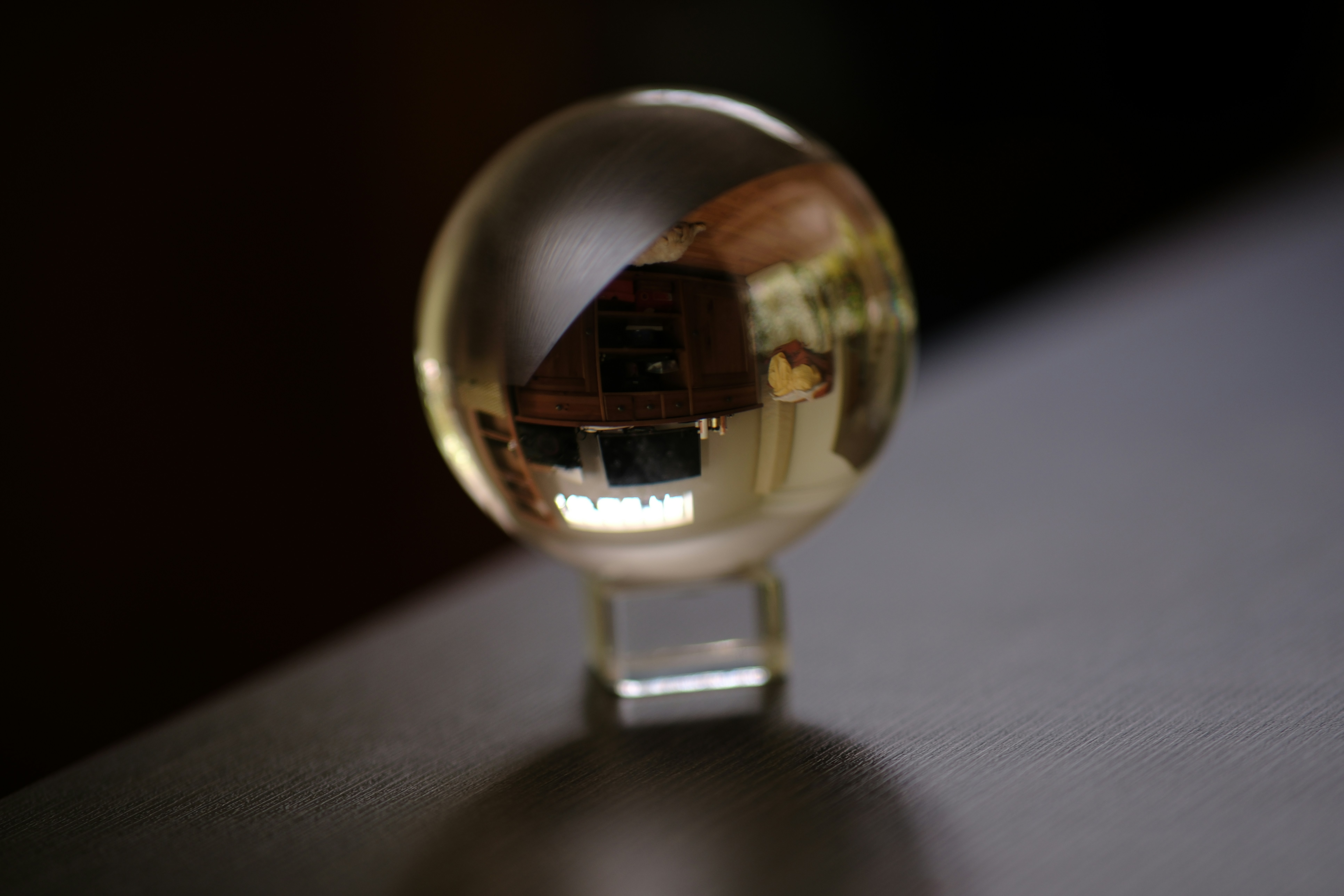 A Sphere of Reflection: Tiny Orb, Infinite Room