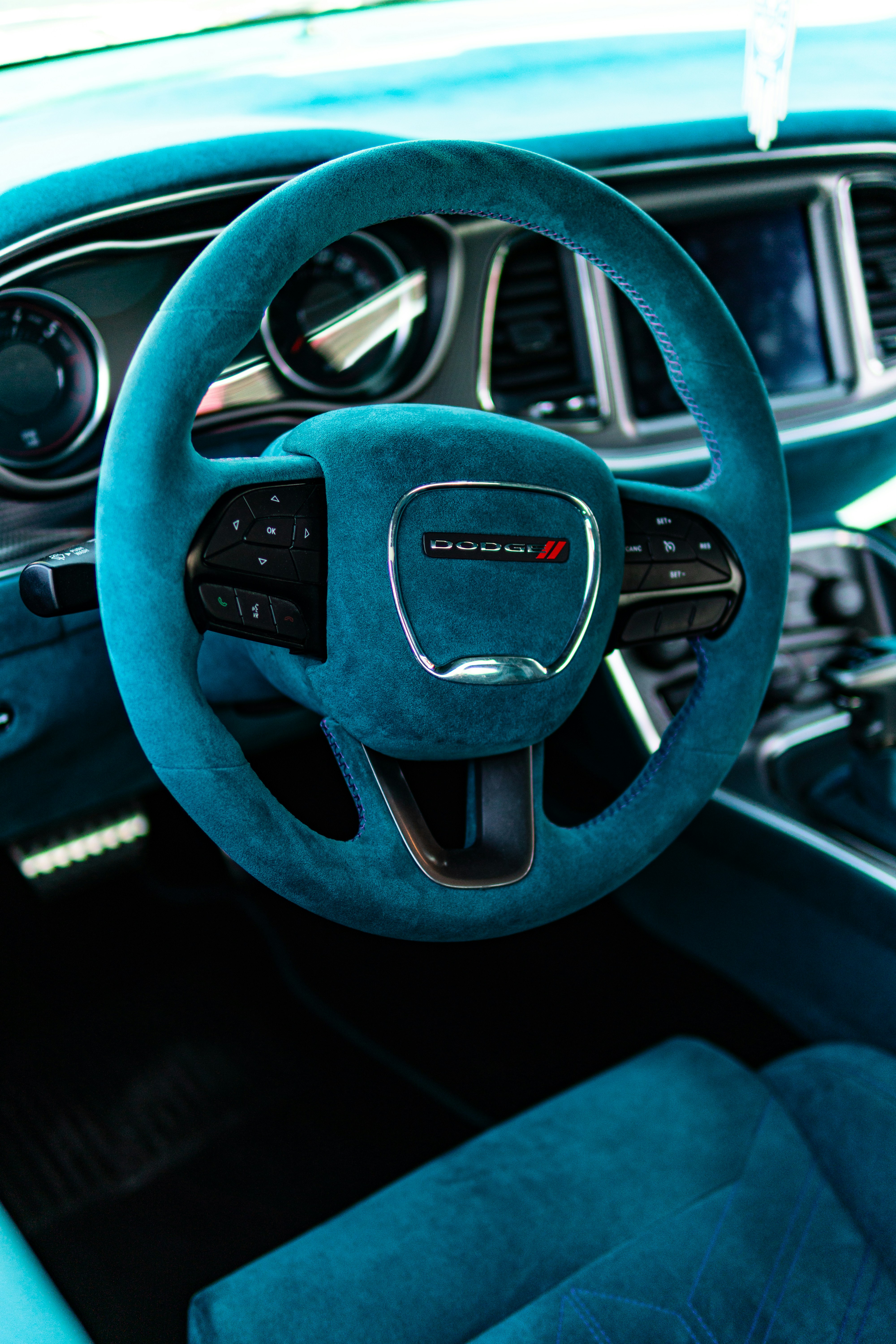 Turquoise Dodge: a suede-steered cockpit in velvet light