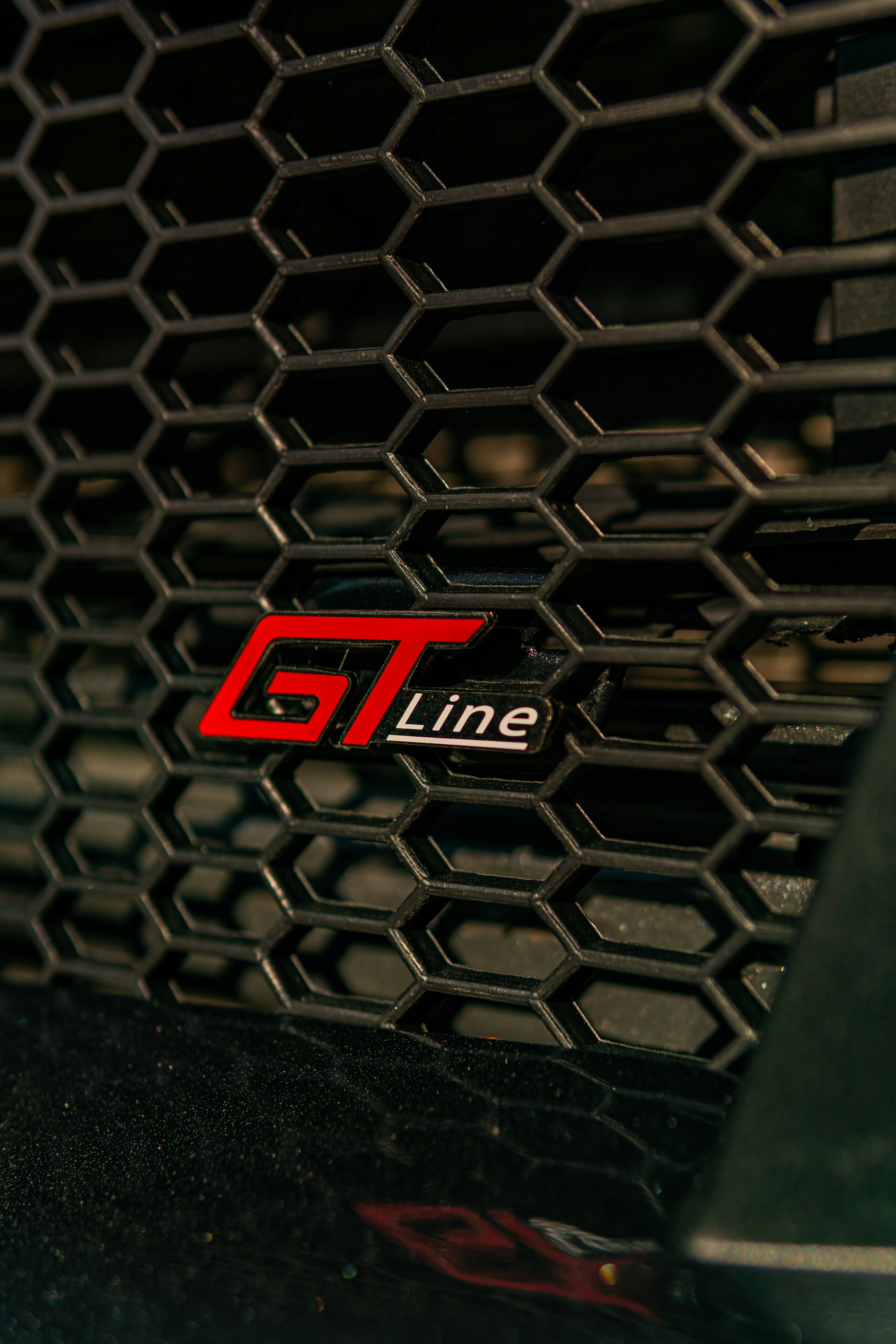 Hexagonal Grille and GT Line Emblem: A Closer Look at the Car's Front Grille