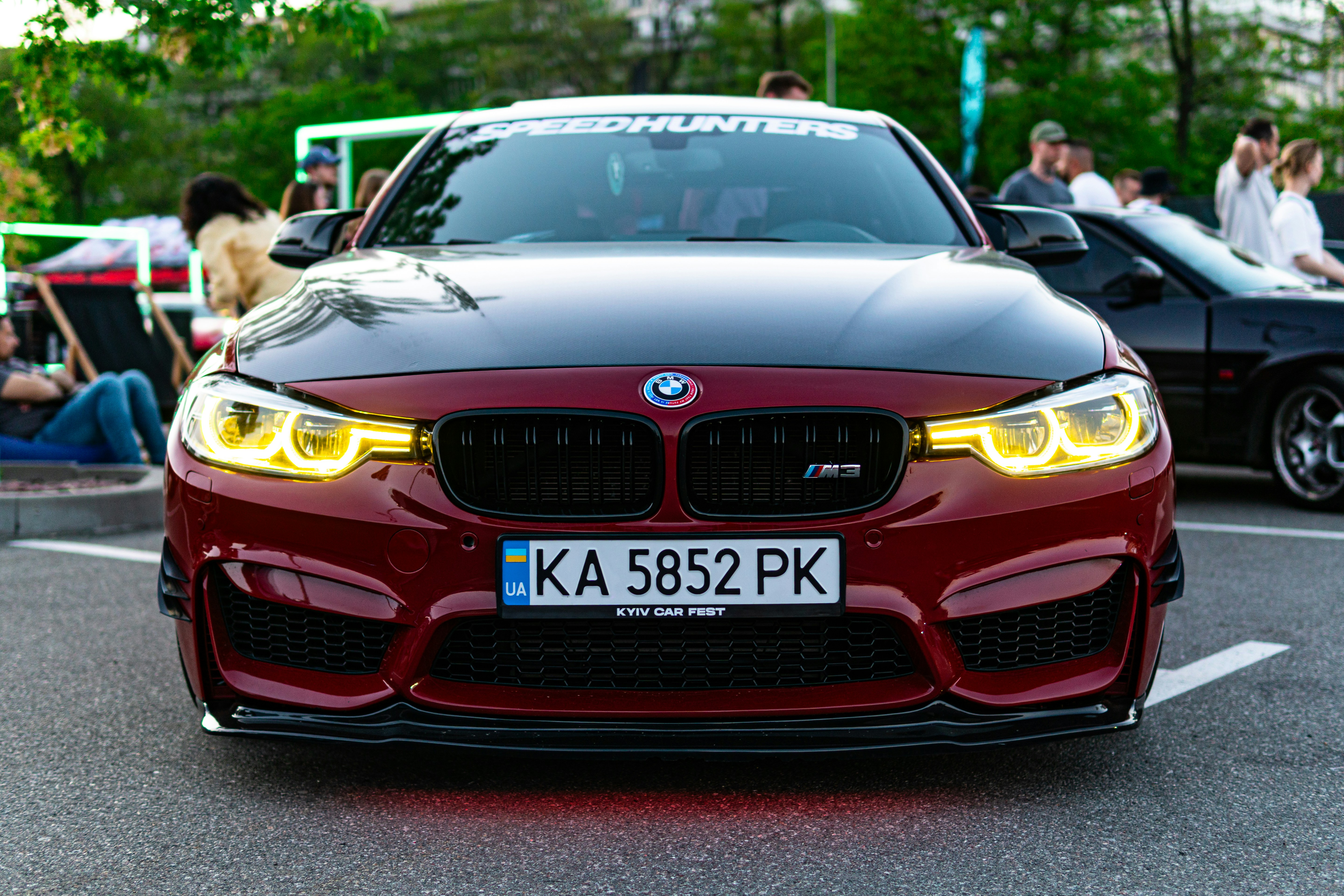 Rear-Row Spotlight: A Bold Red BMW Stance at a Car Meet