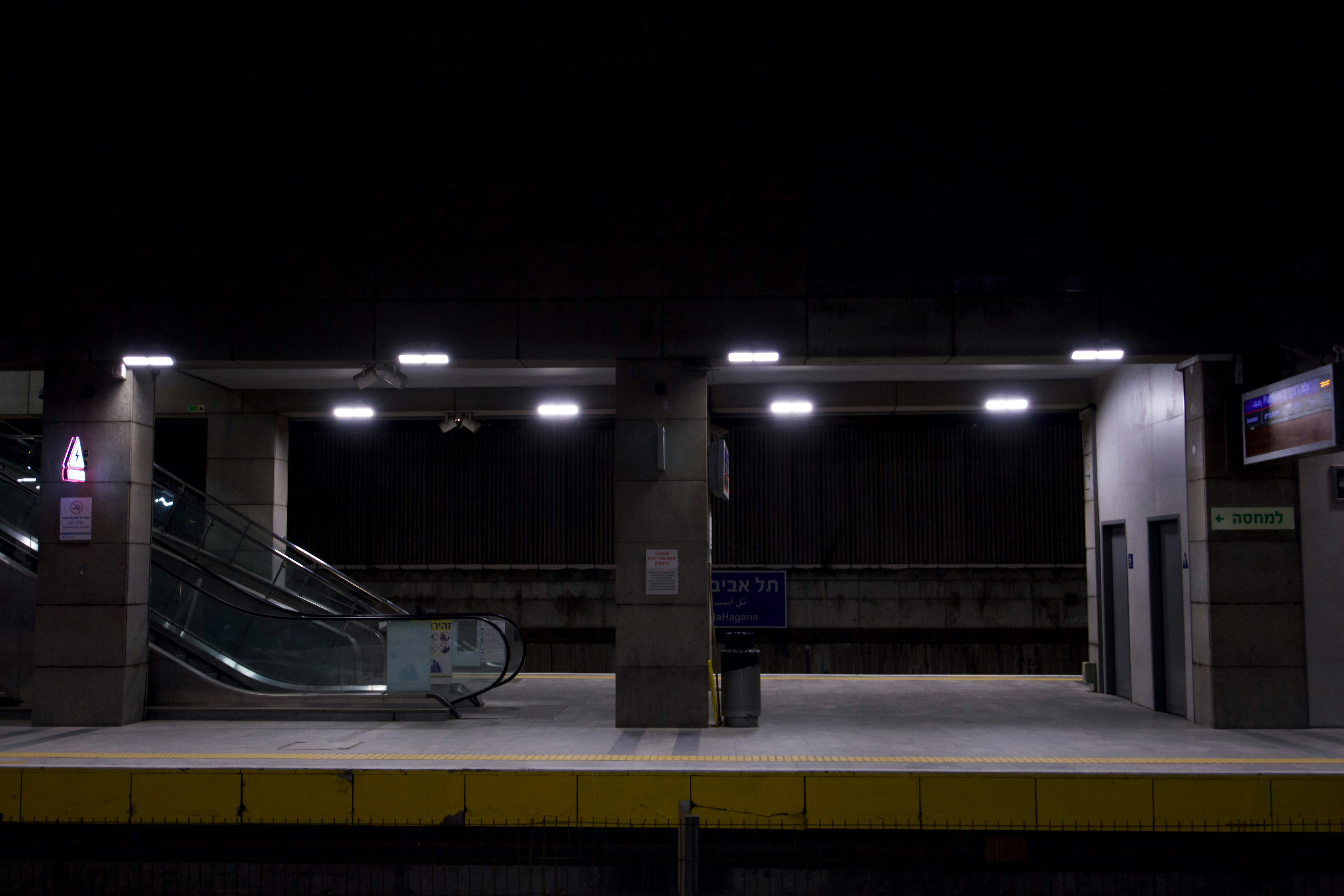 Quiet Platform Under Neon Fluorescence