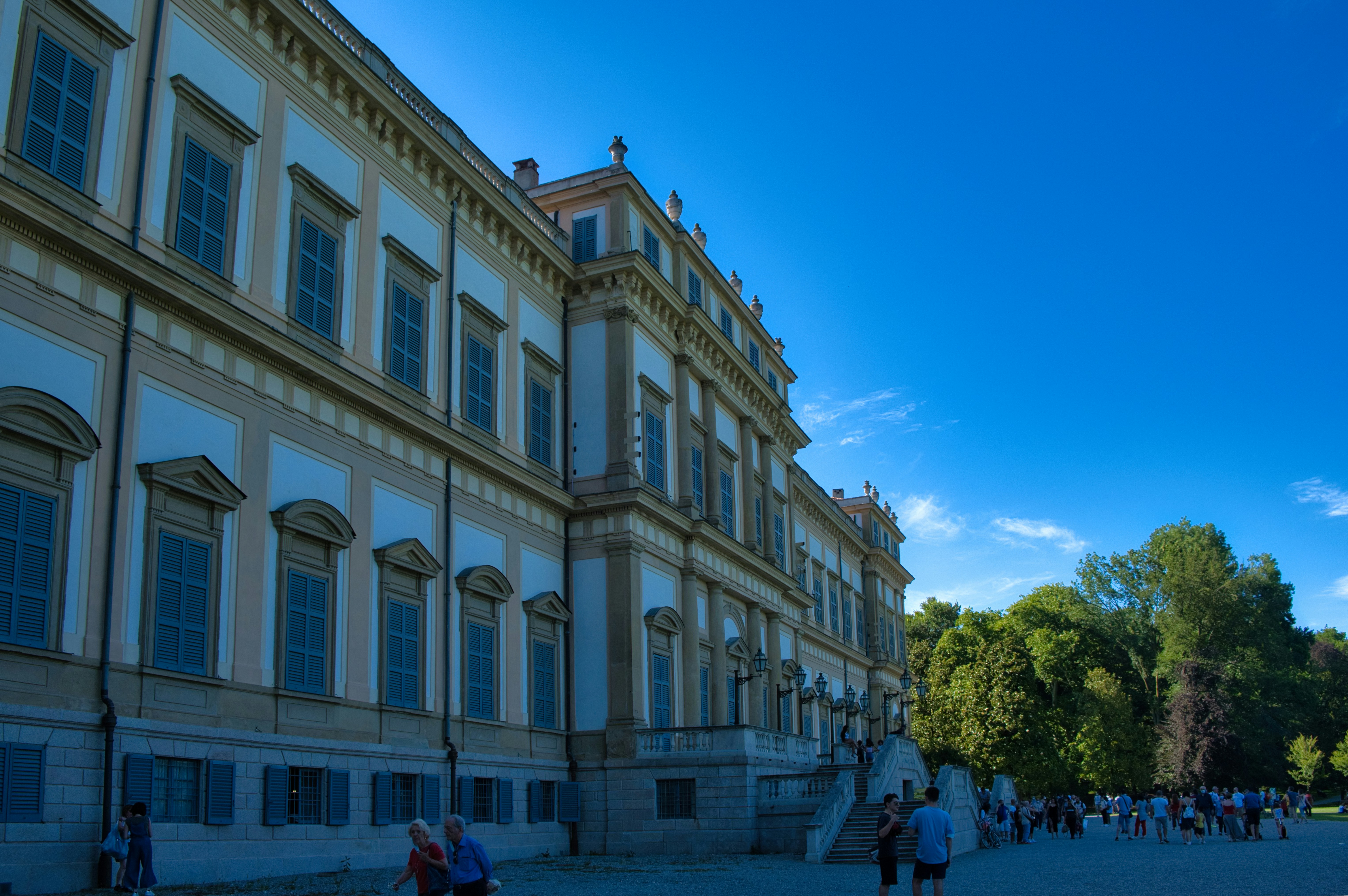 Baroque Facade Pastures: A Sunlit Courtyard Corridor