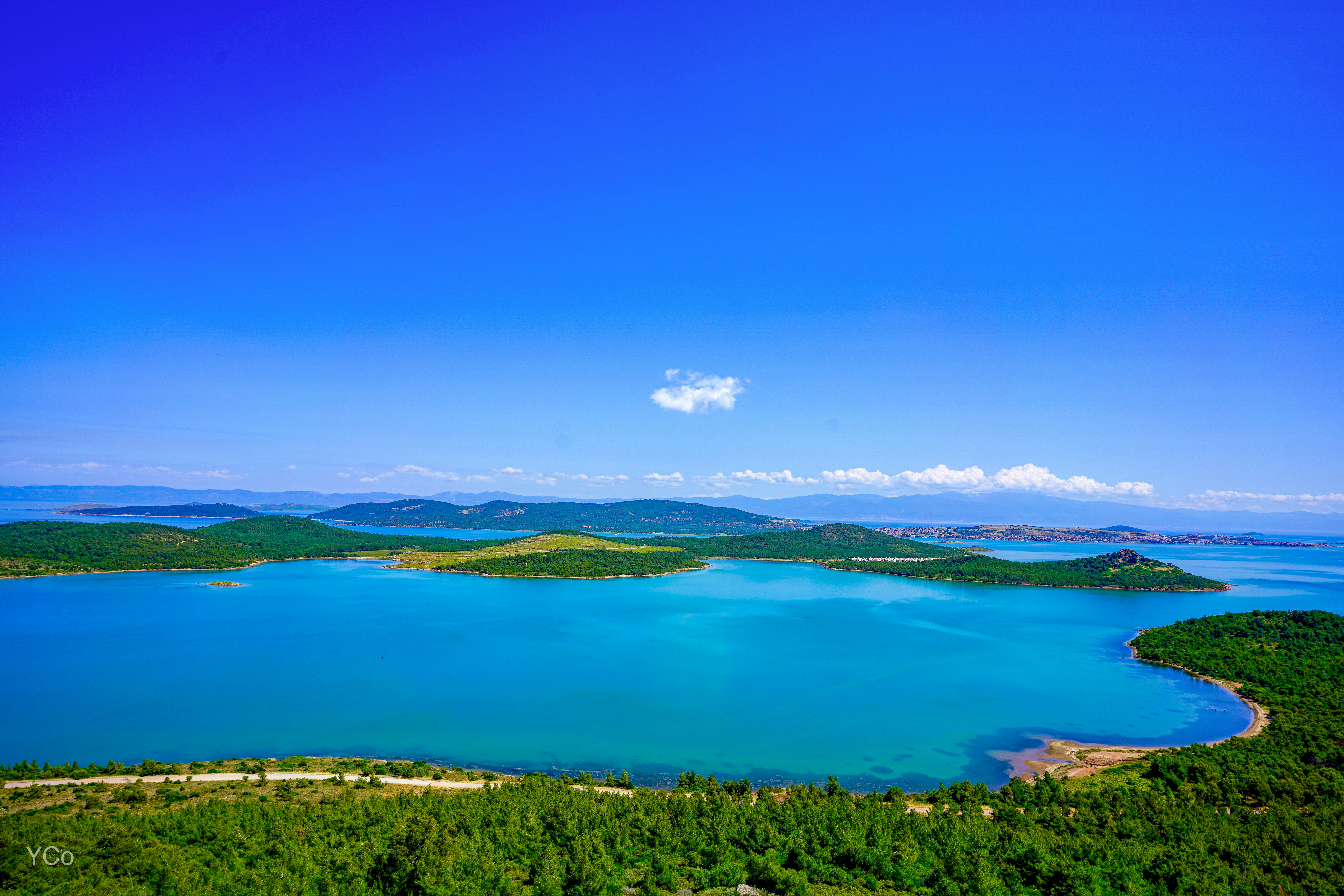 Azure Shorelines: A Wide Lagoon Under a Velvet Sky