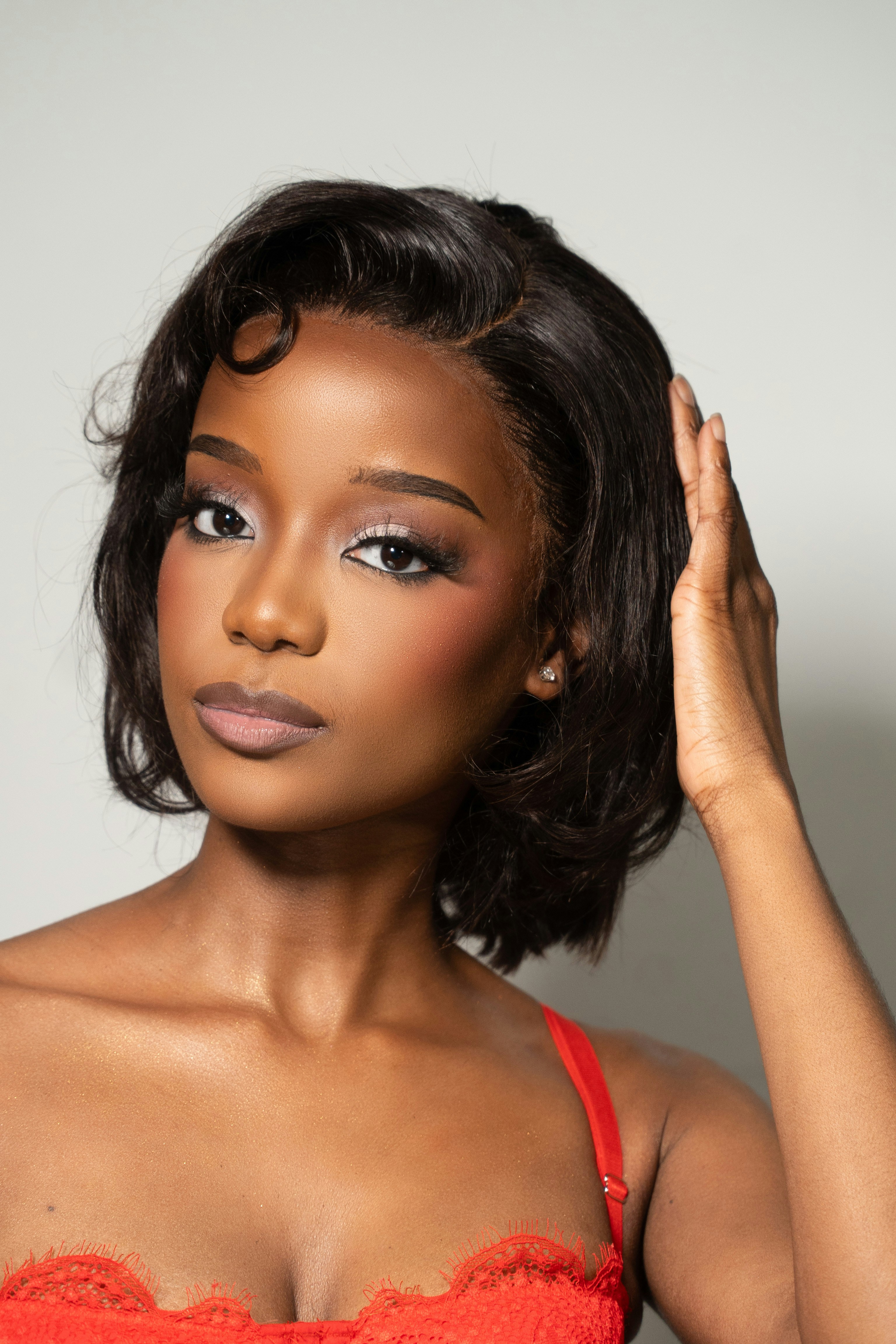 Glow and Grace: Portrait of Confidence in Red Lace