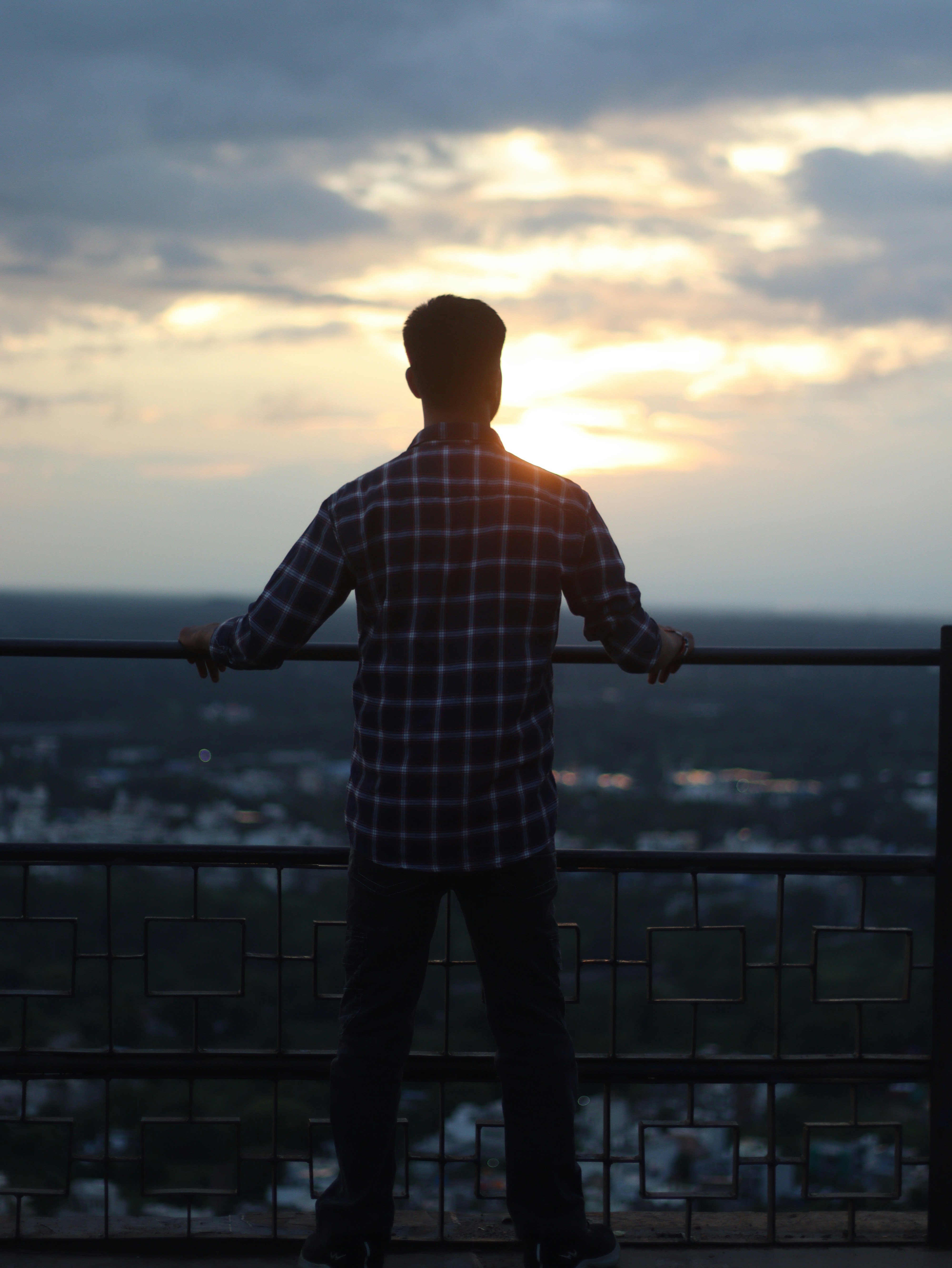 Silhouette at Sunset: Watching the Horizon