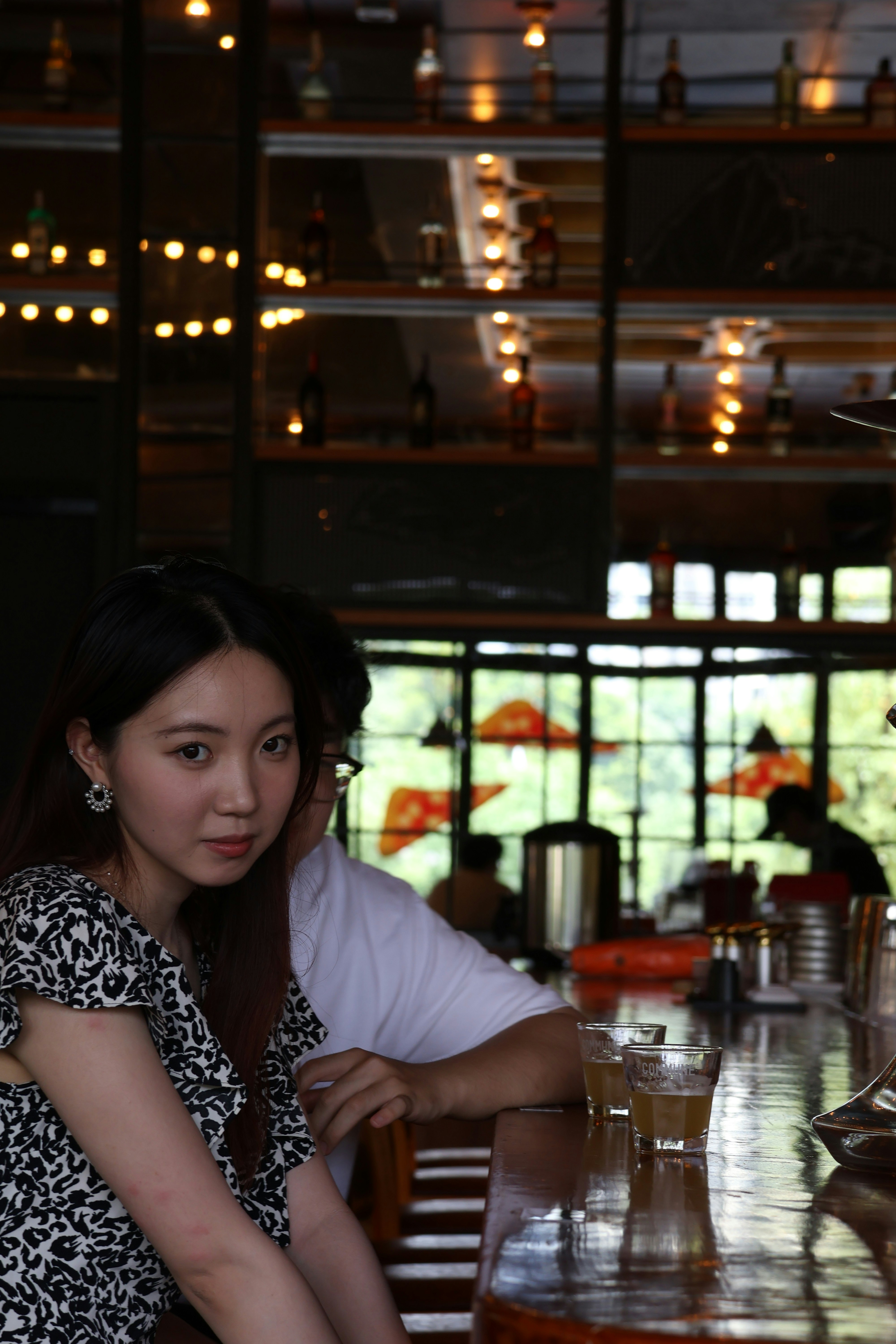 Soft-lit Bar Portrait: A Quiet Moment at the Counter
