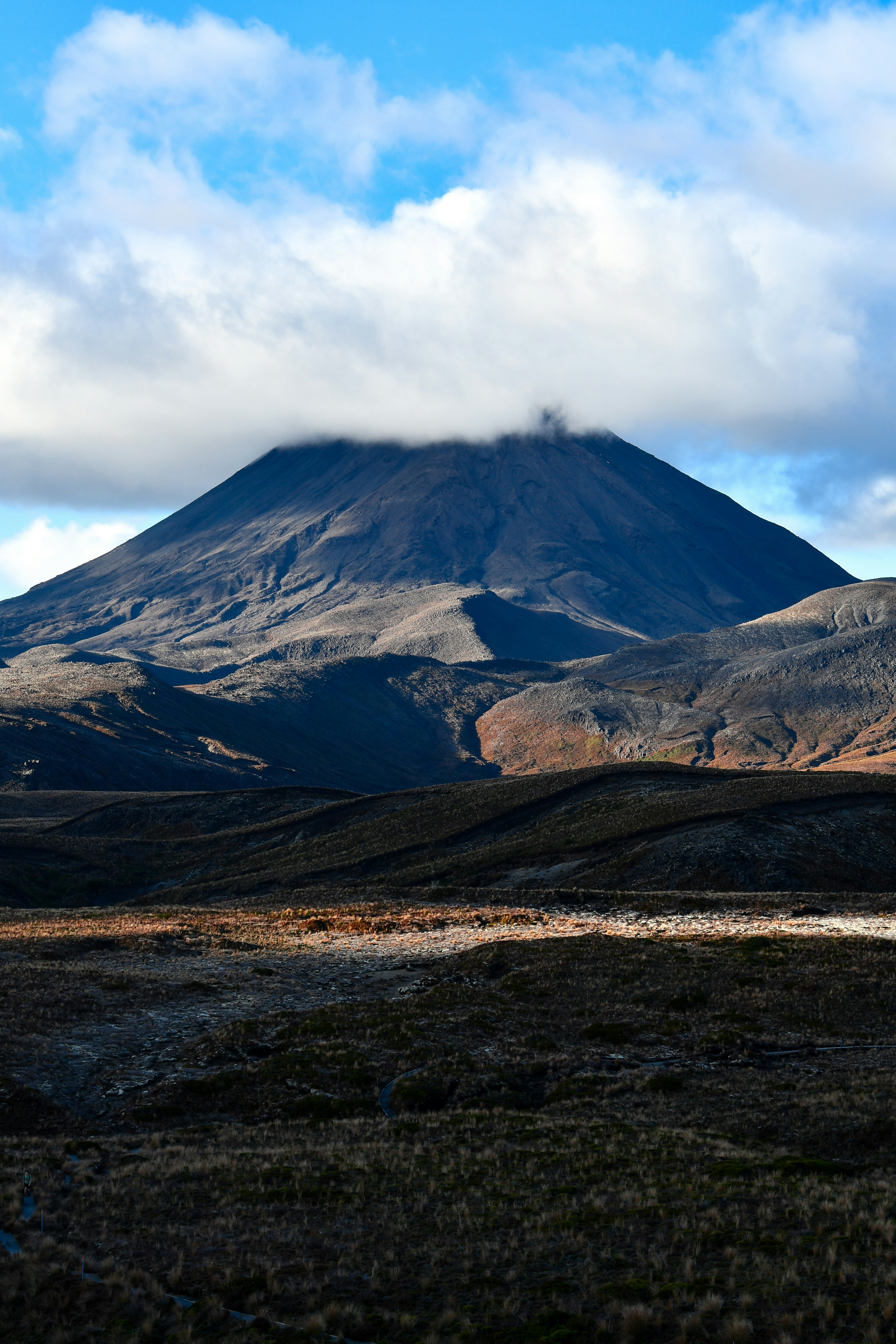 Isolated Peak Under a Puffy Crown