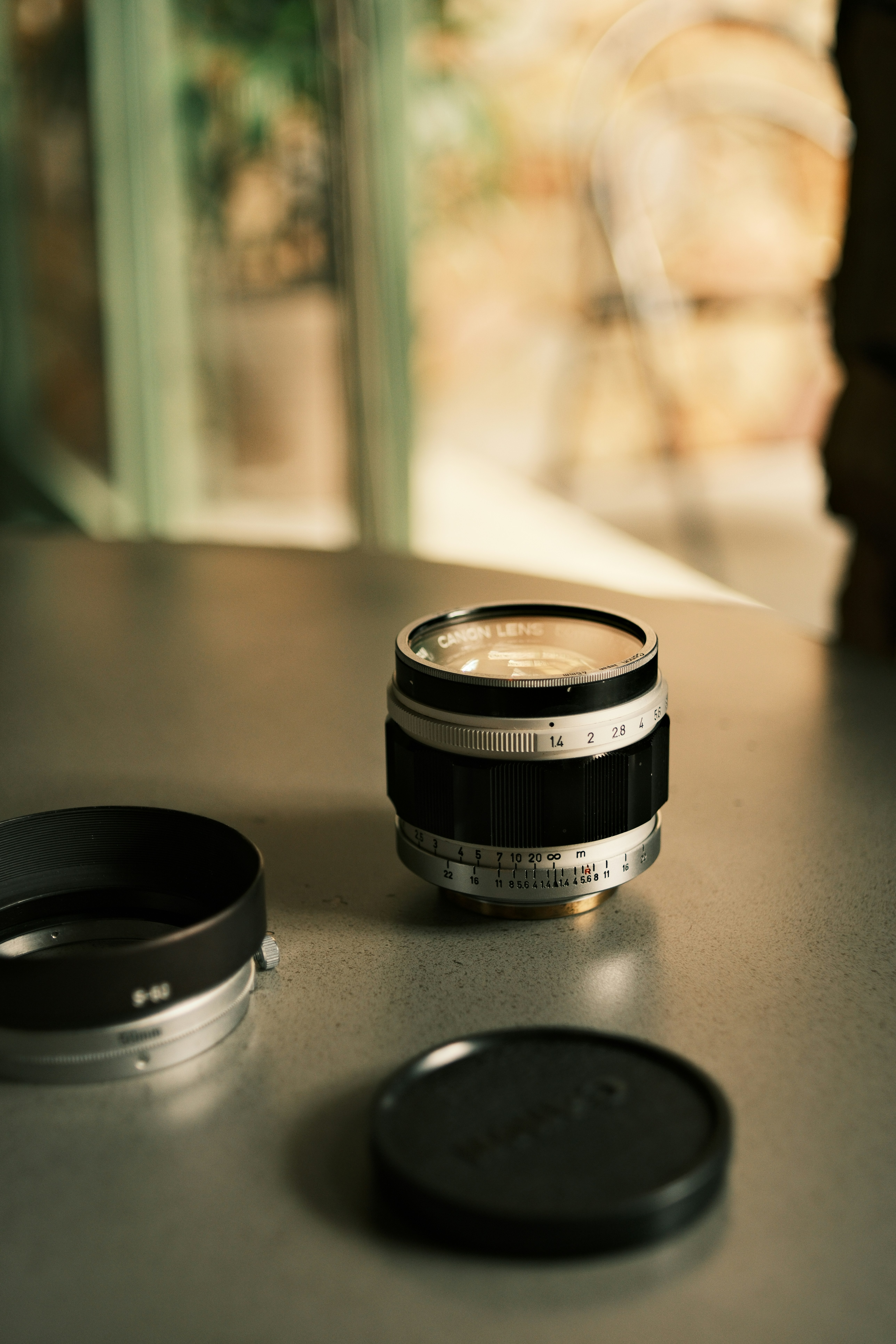 Still Life of a Lens: Quiet Moment on a Workshop Table