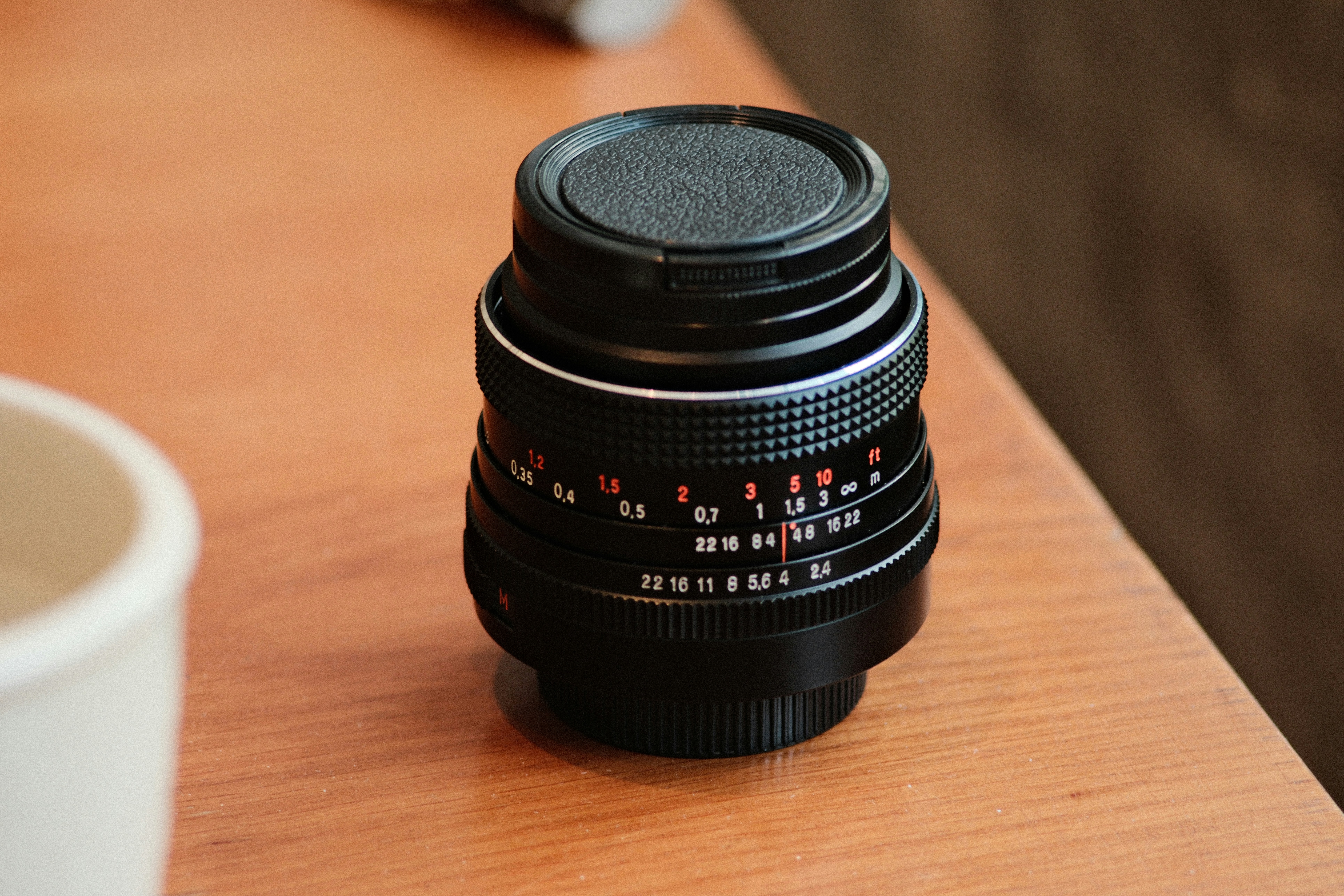 Compact Prime Lens in Focus: A Quiet Studio Moment