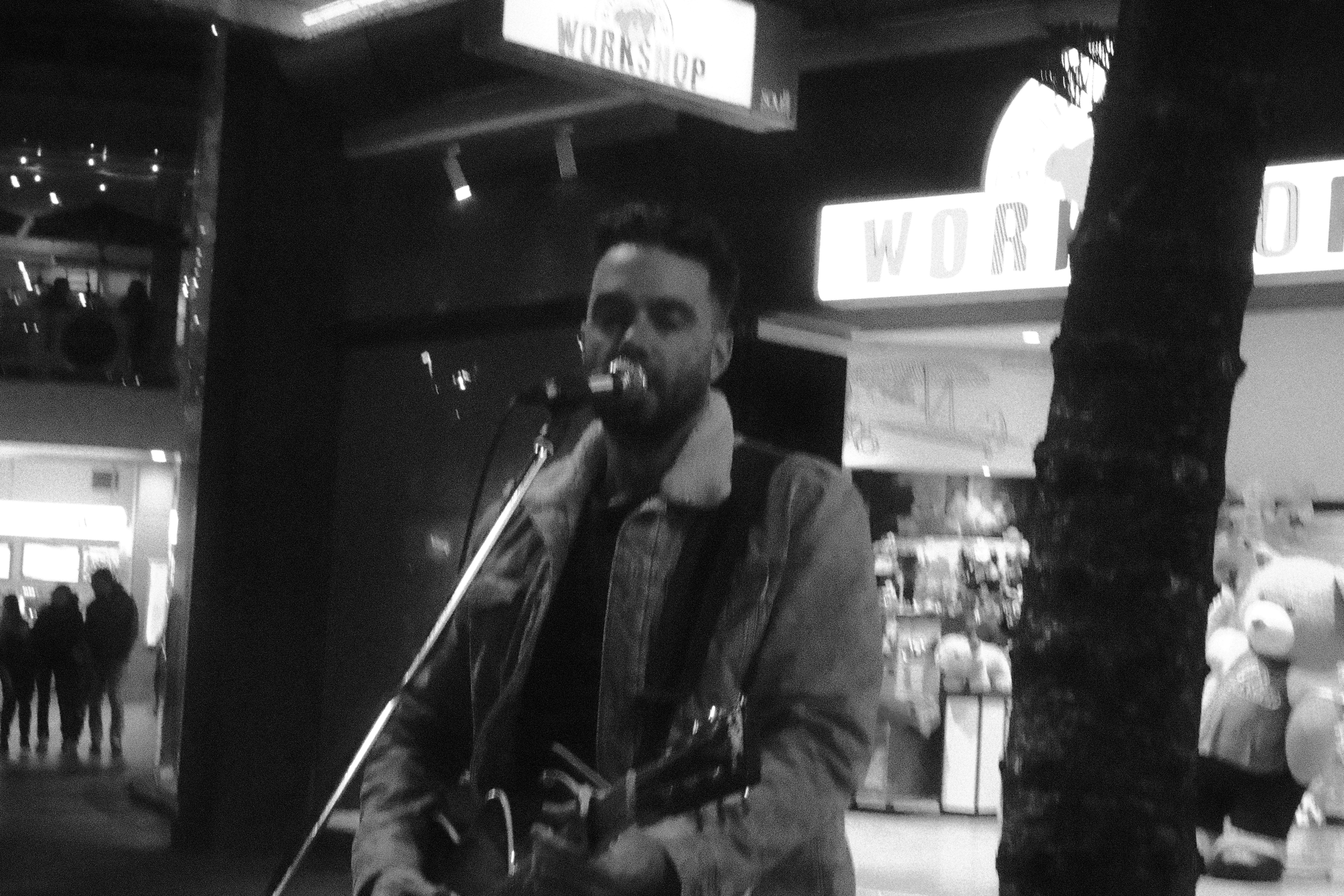 Midnight Busker Under Neon Echoes