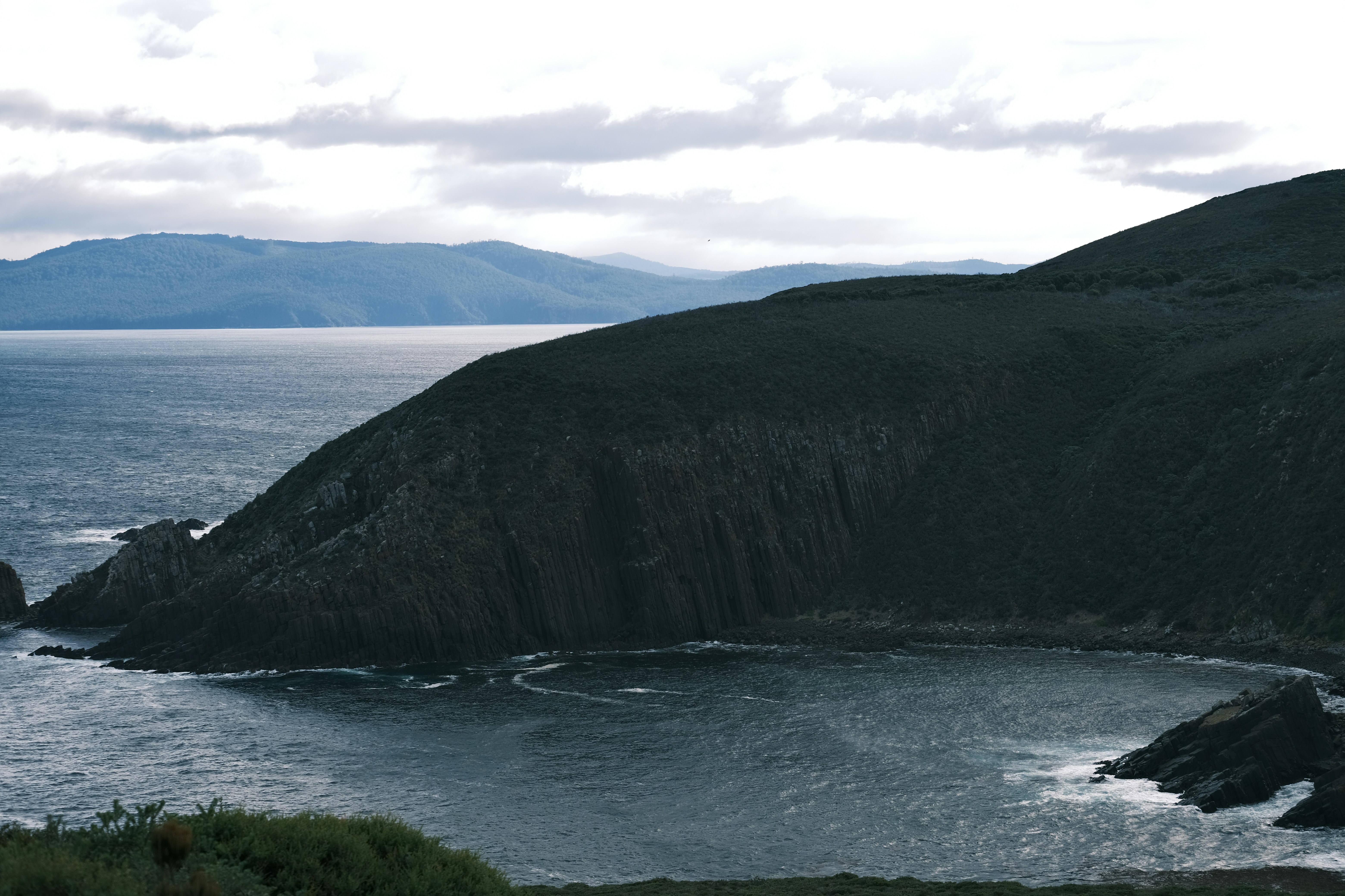 Coastal Headland Overlooking a Quiet Bay at Dusk