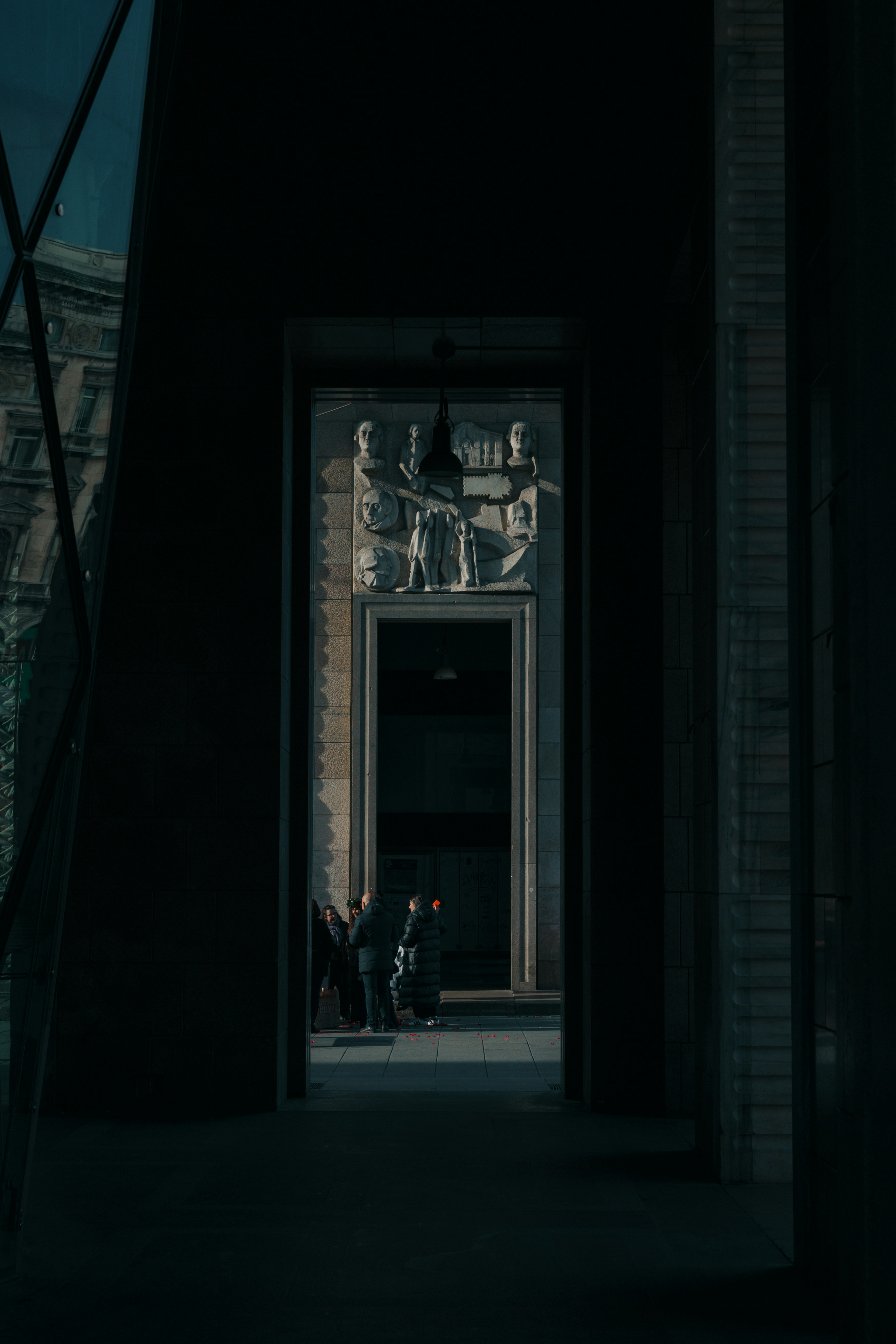 Through the Gate of Shadowed Facades