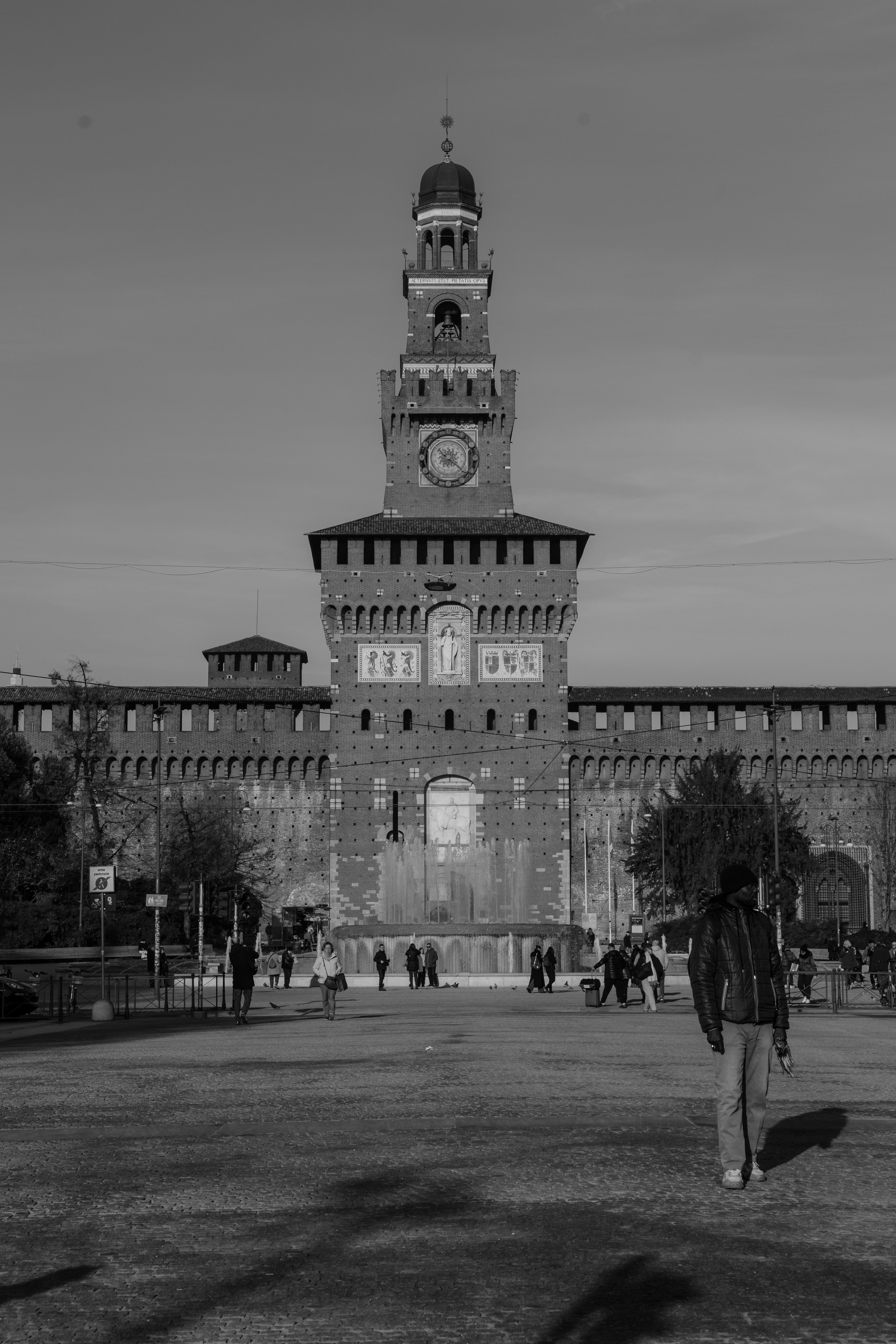 Towering Clock and Parapet: A Quiet Piazza Under a Midnight Sky