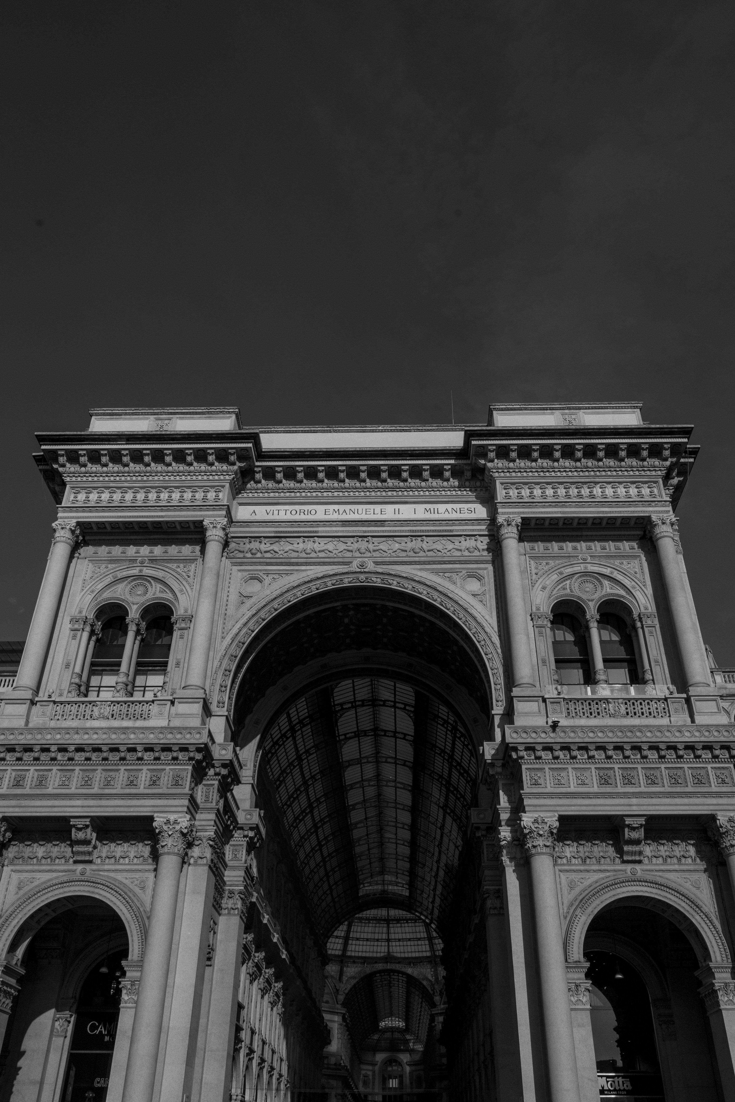 Archway of Grandeur: Marble Facade Framed by a Distant Sky