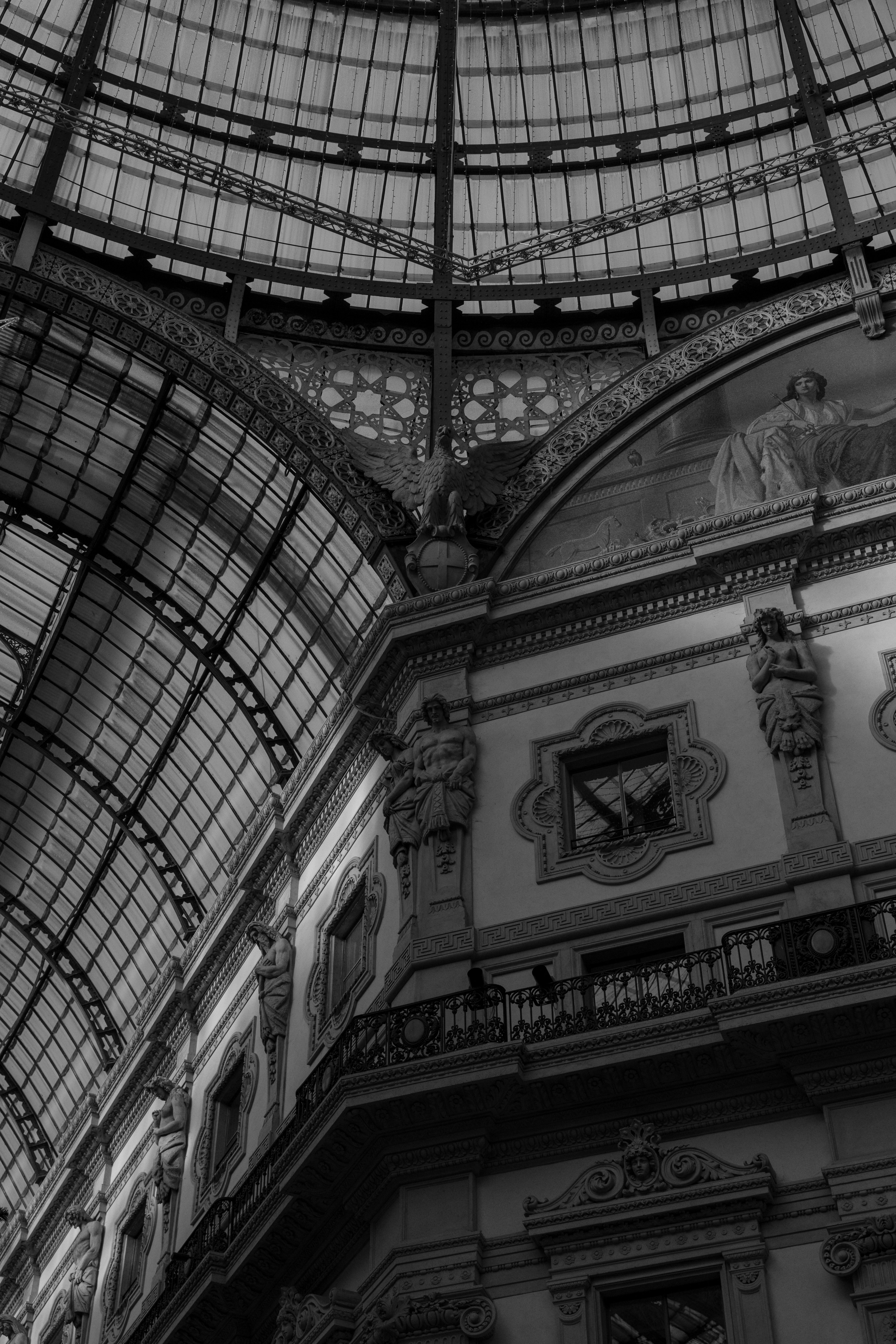 Arched Glass and Baroque Detail: A Monumental Interior in Monochrome