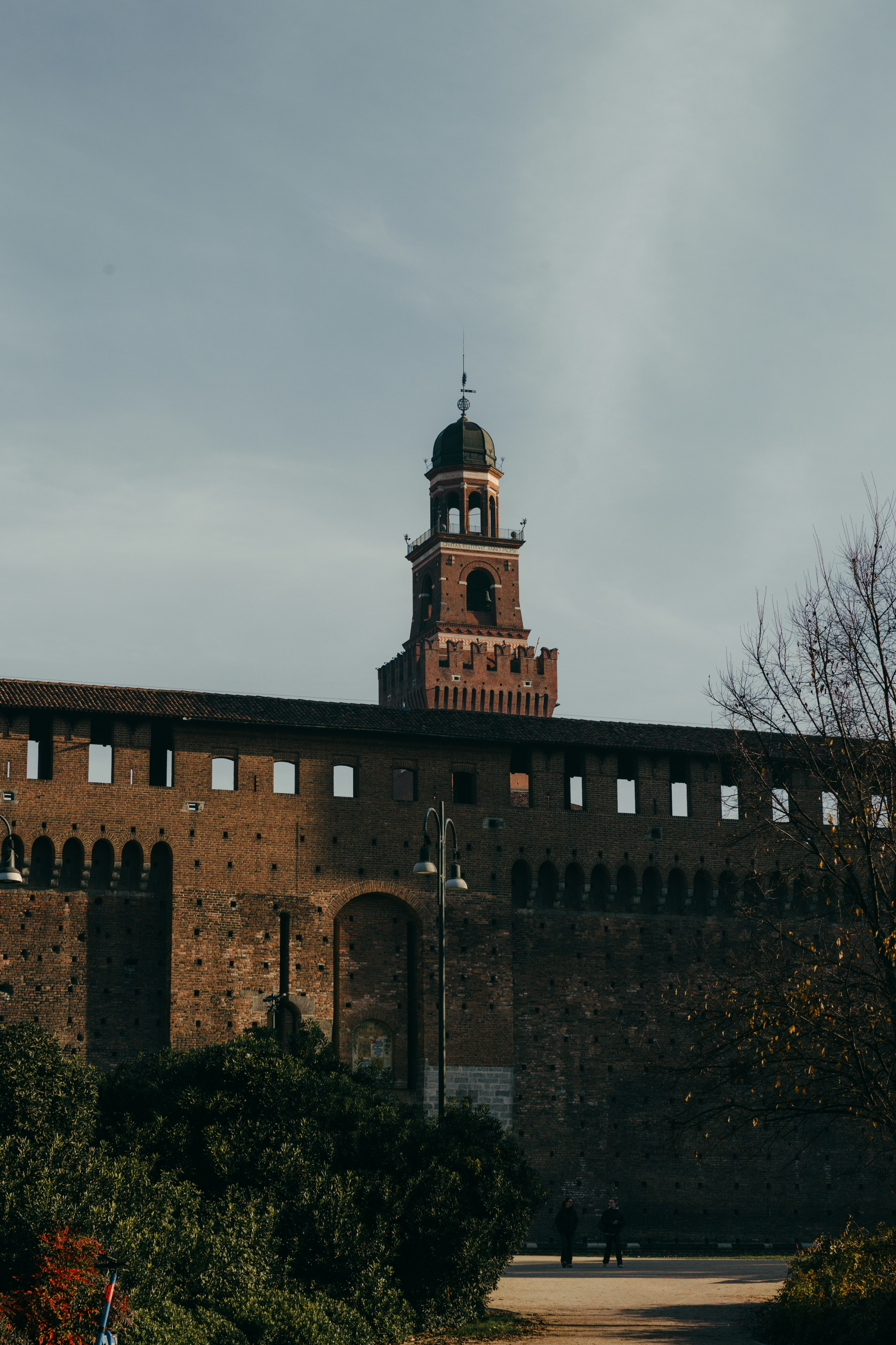 Brick Fortress Tower Rising Above the Courtyard Wall