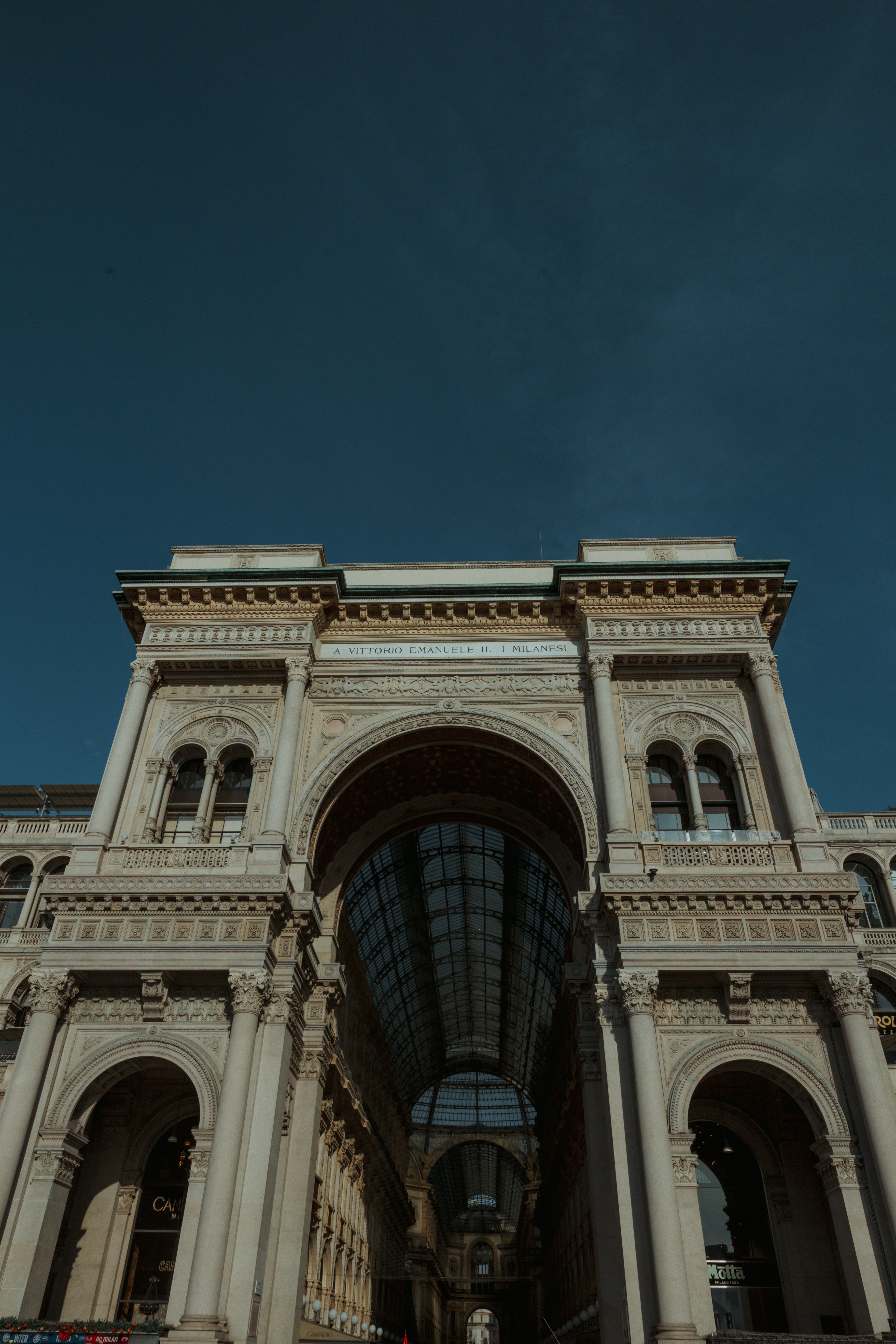Archway of Grandeur: Milan’s Galleria Framed Under Blue Sky
