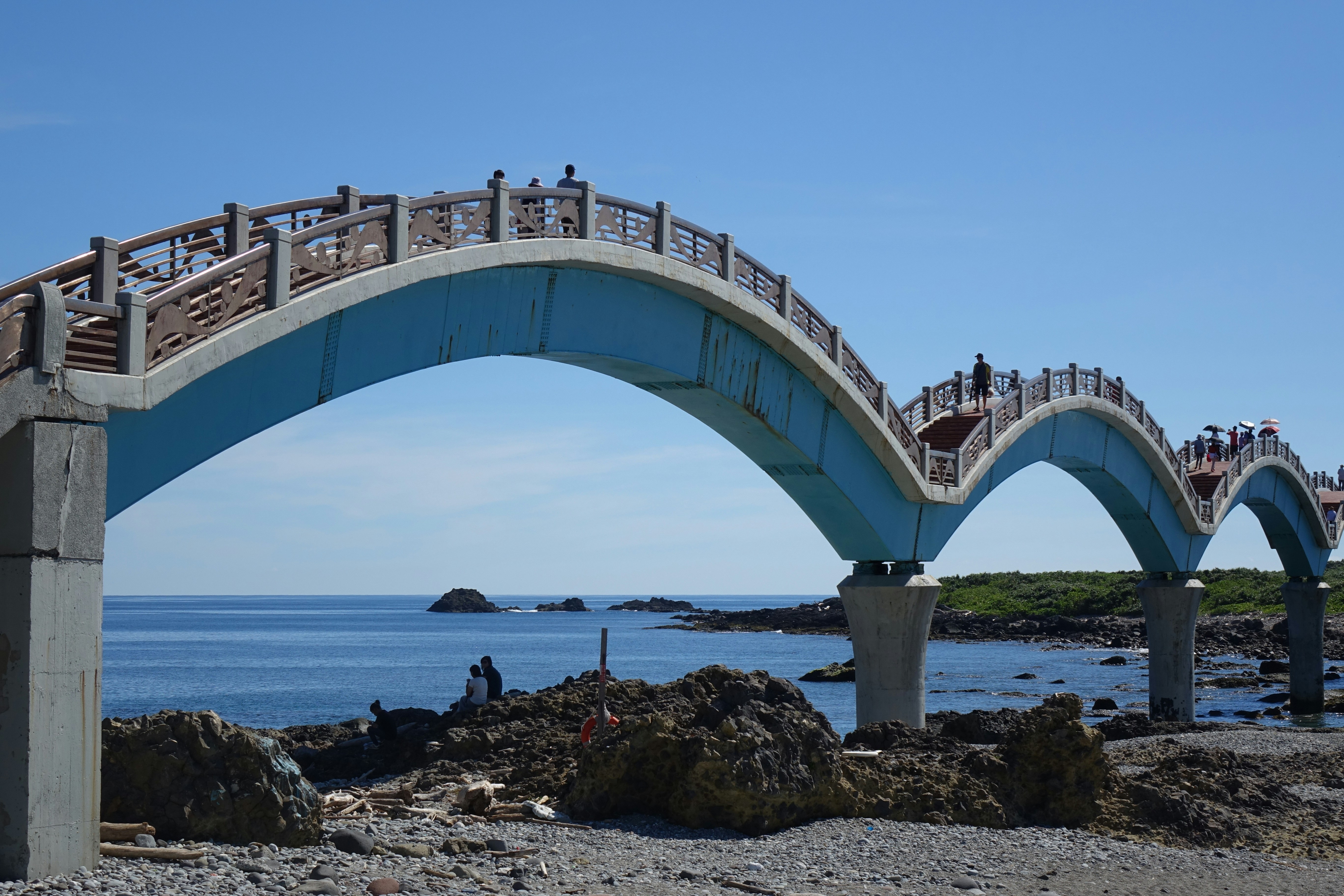 Curved Coastal Bridge Spanning a Quiet Seaside